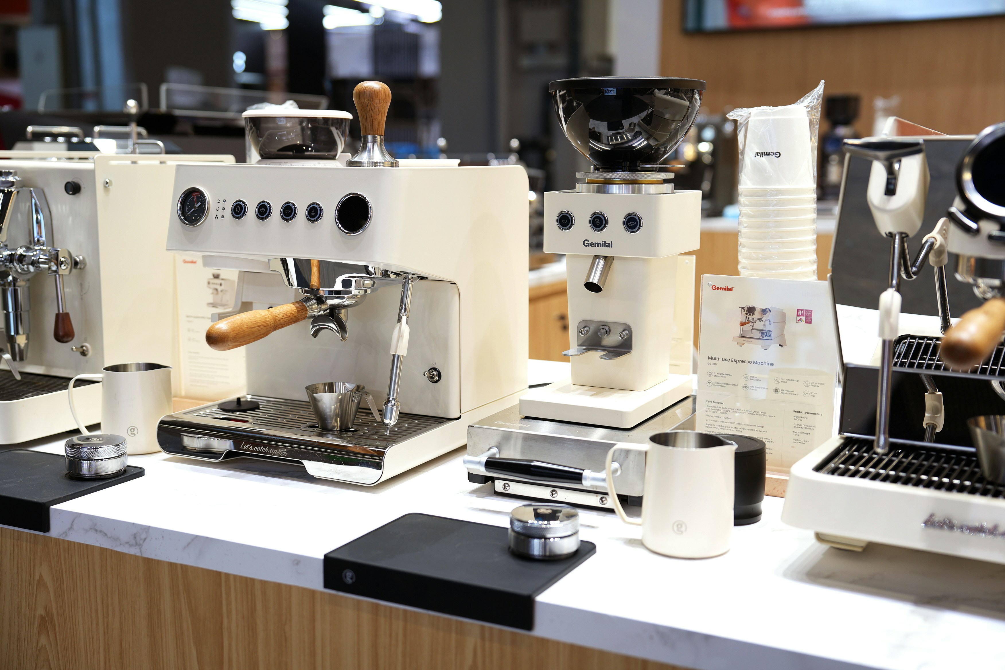 Creamy Espresso Machines Sit in a Row at a Café Showroom