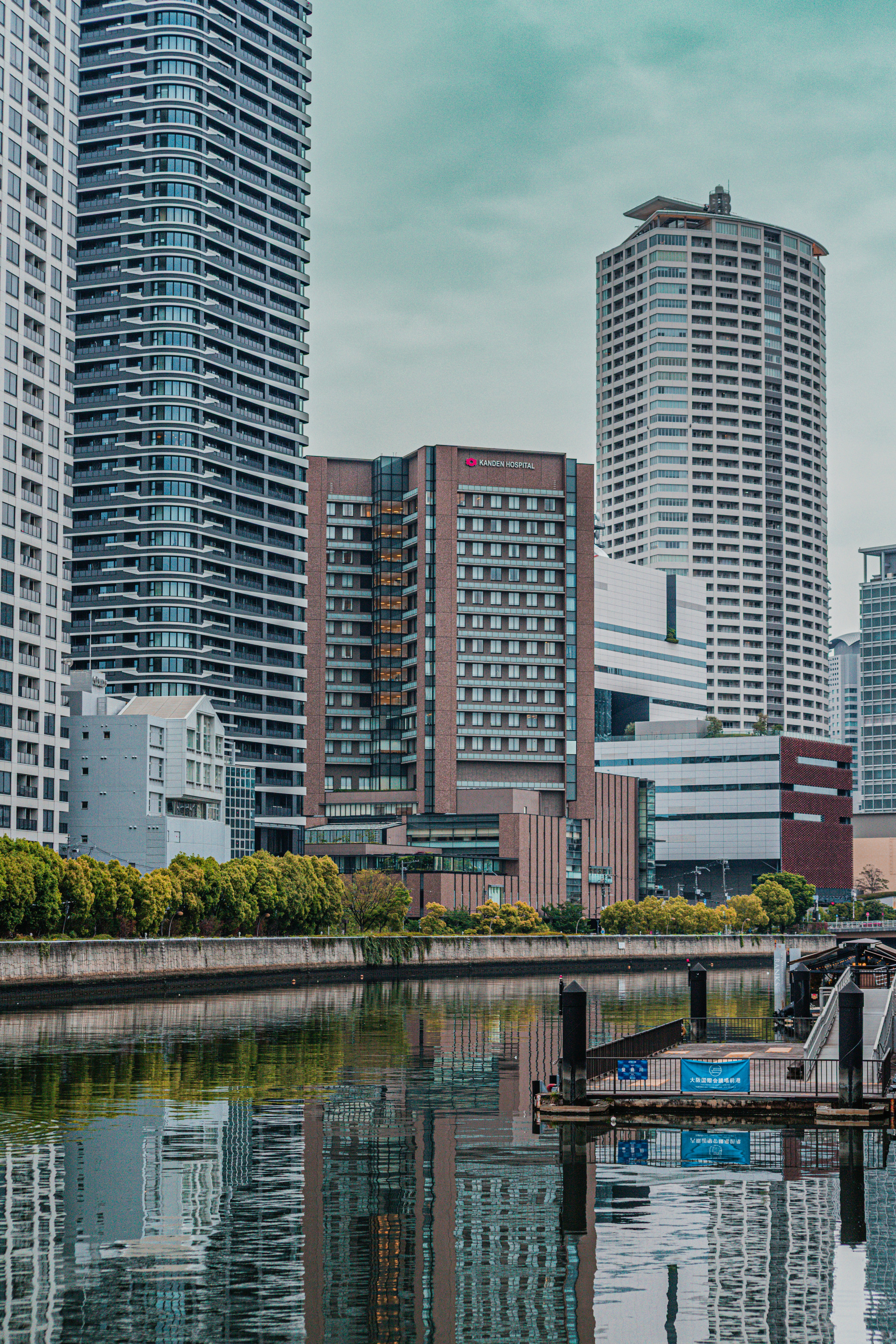 Urban Riverfront Dormers: Glass and Concrete Cast Over Reflections
