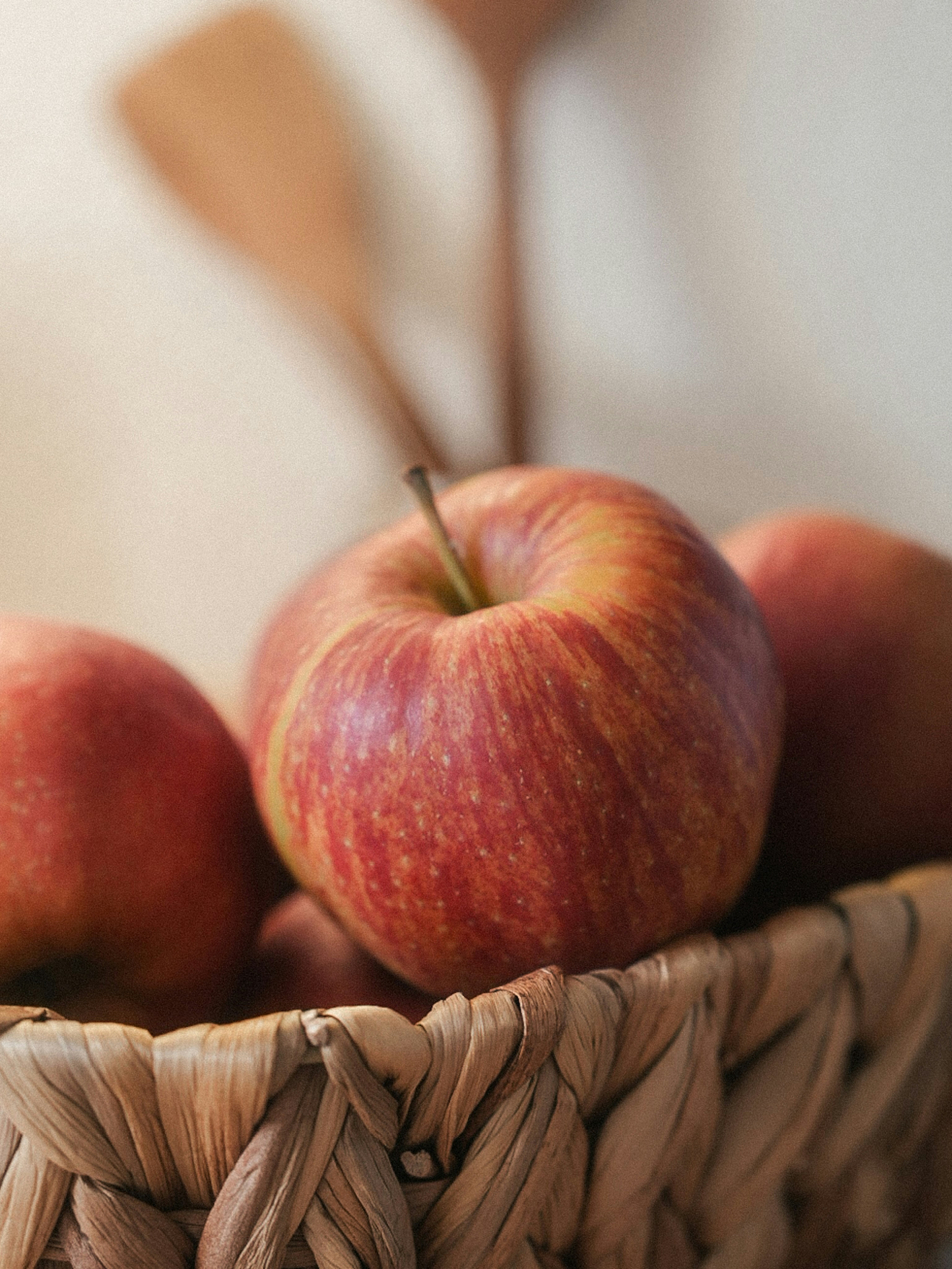 Golden Basket: A Red Apple Reigns Over the Rim