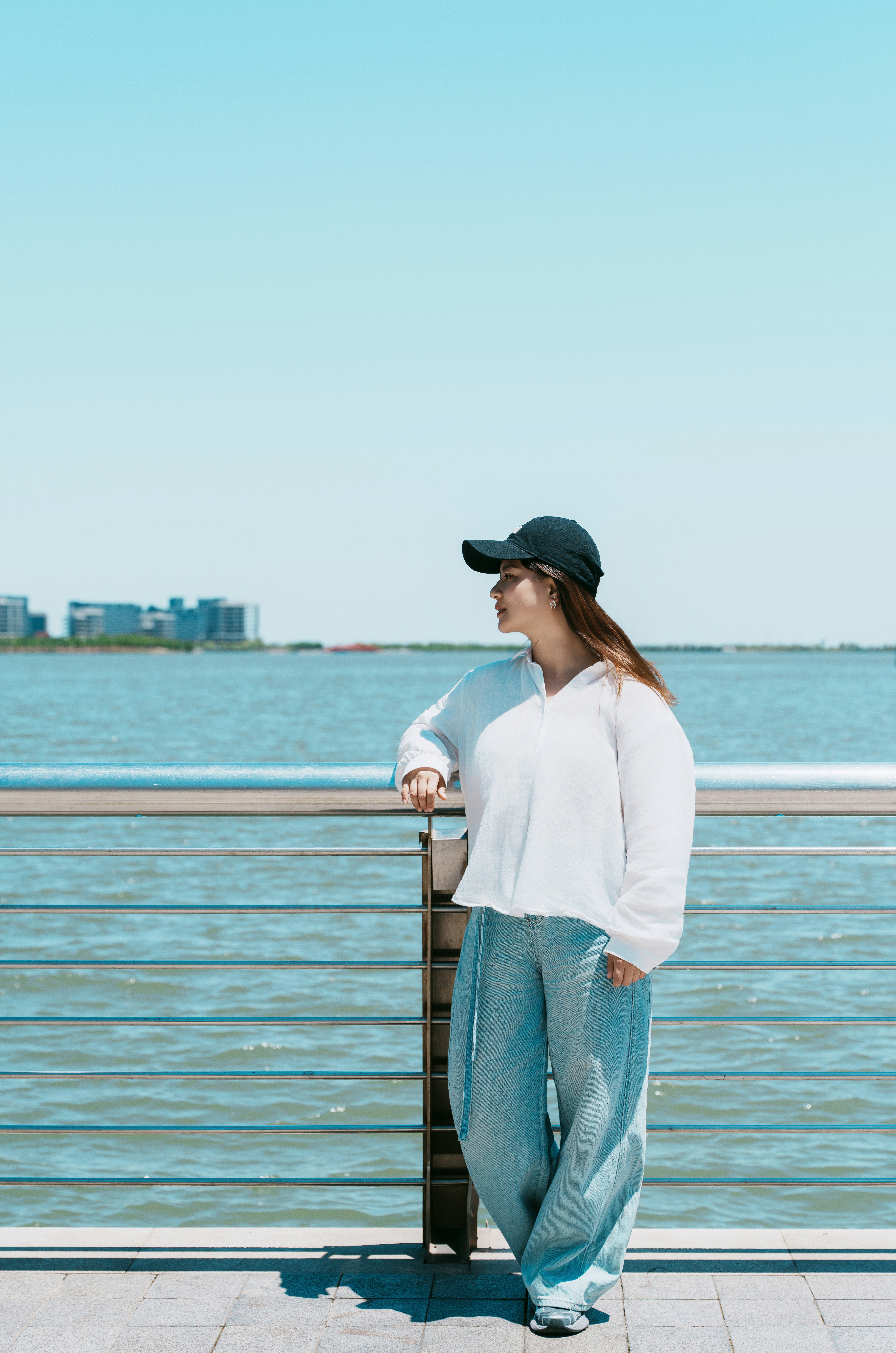Coastal Confidence: A Seaside Portrait on a Bright Day