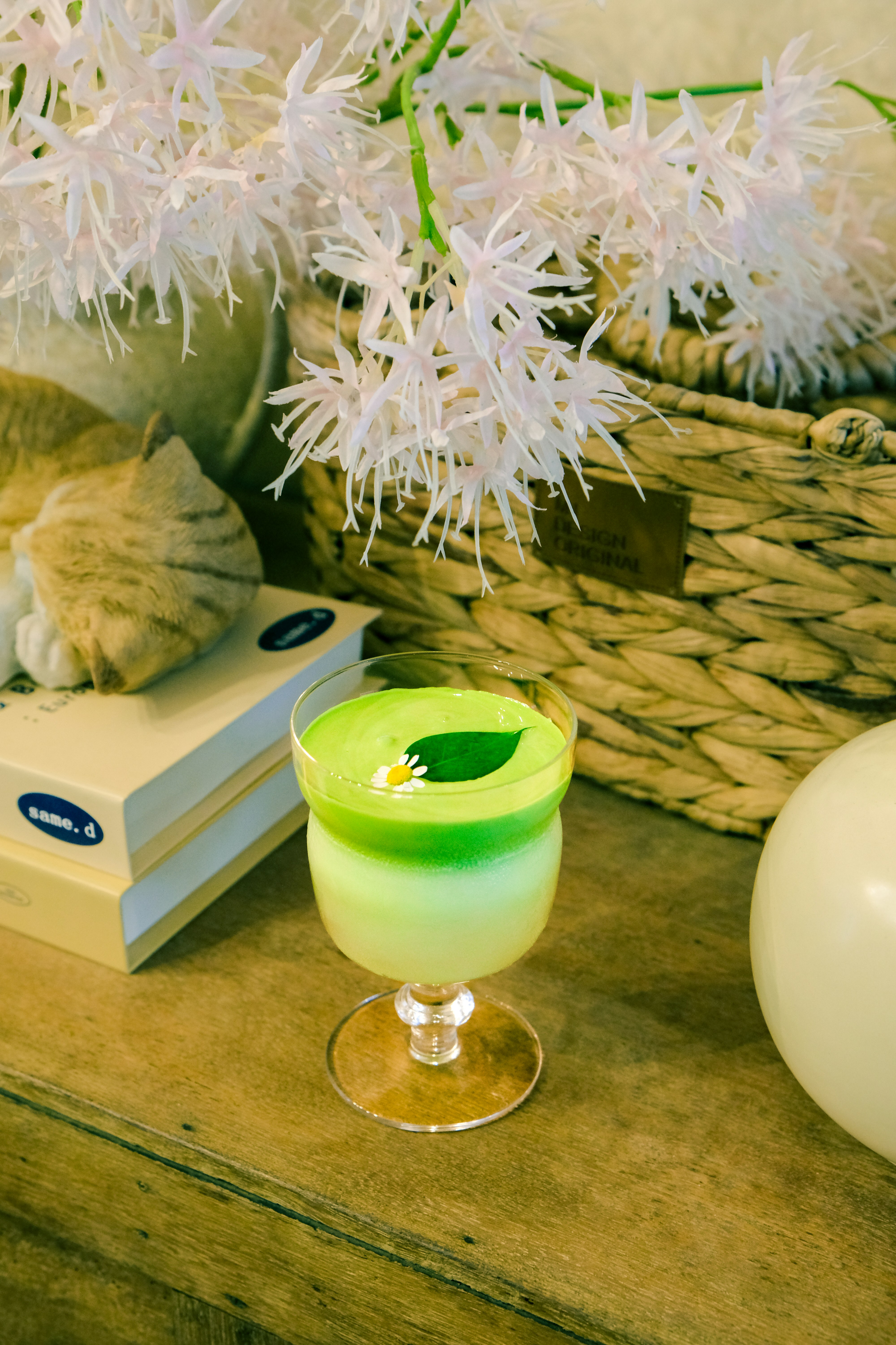 Verdant Sunrise in a Green-Top Cocktail on a Rustic Table