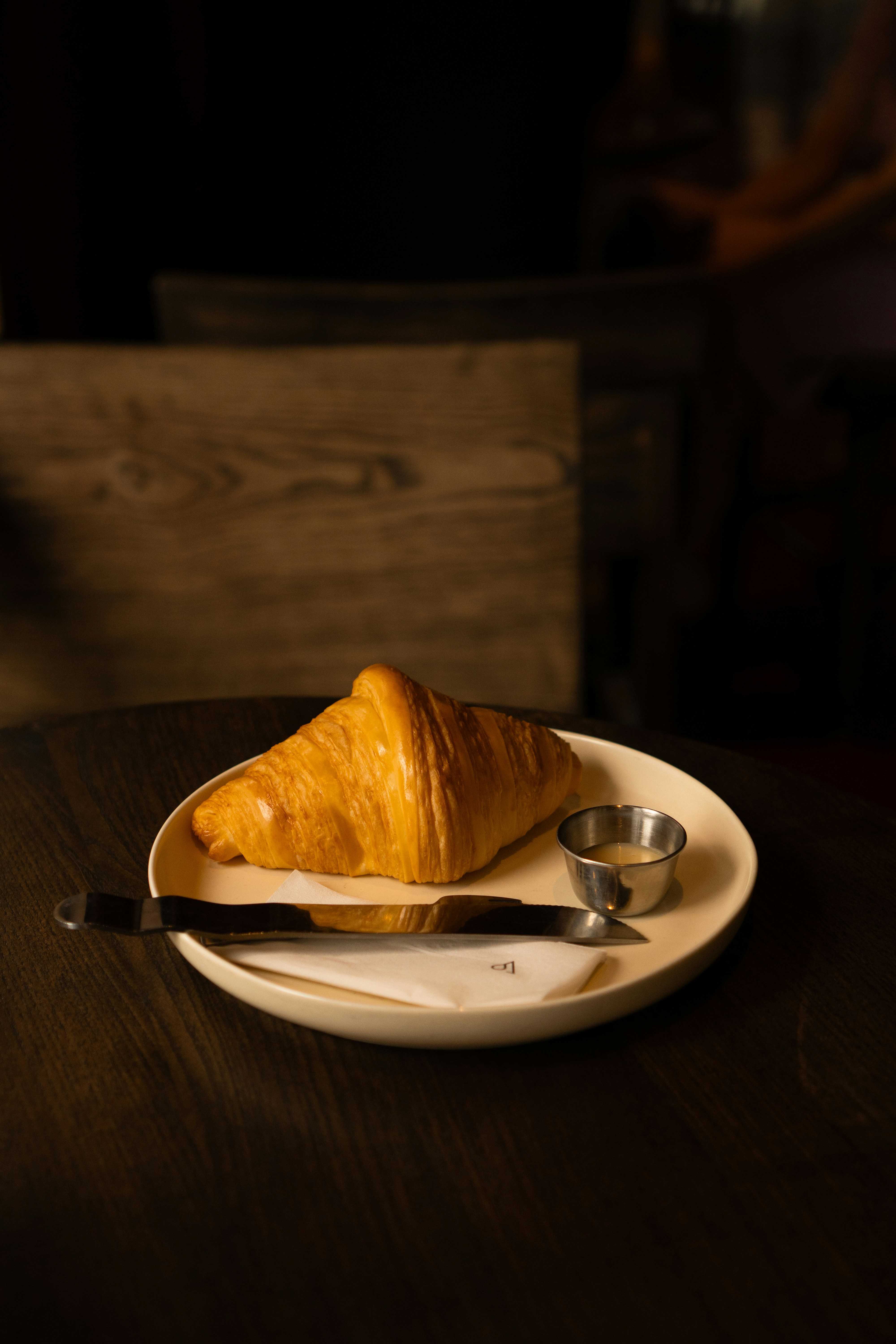 Golden Croissant on a Quiet Plate