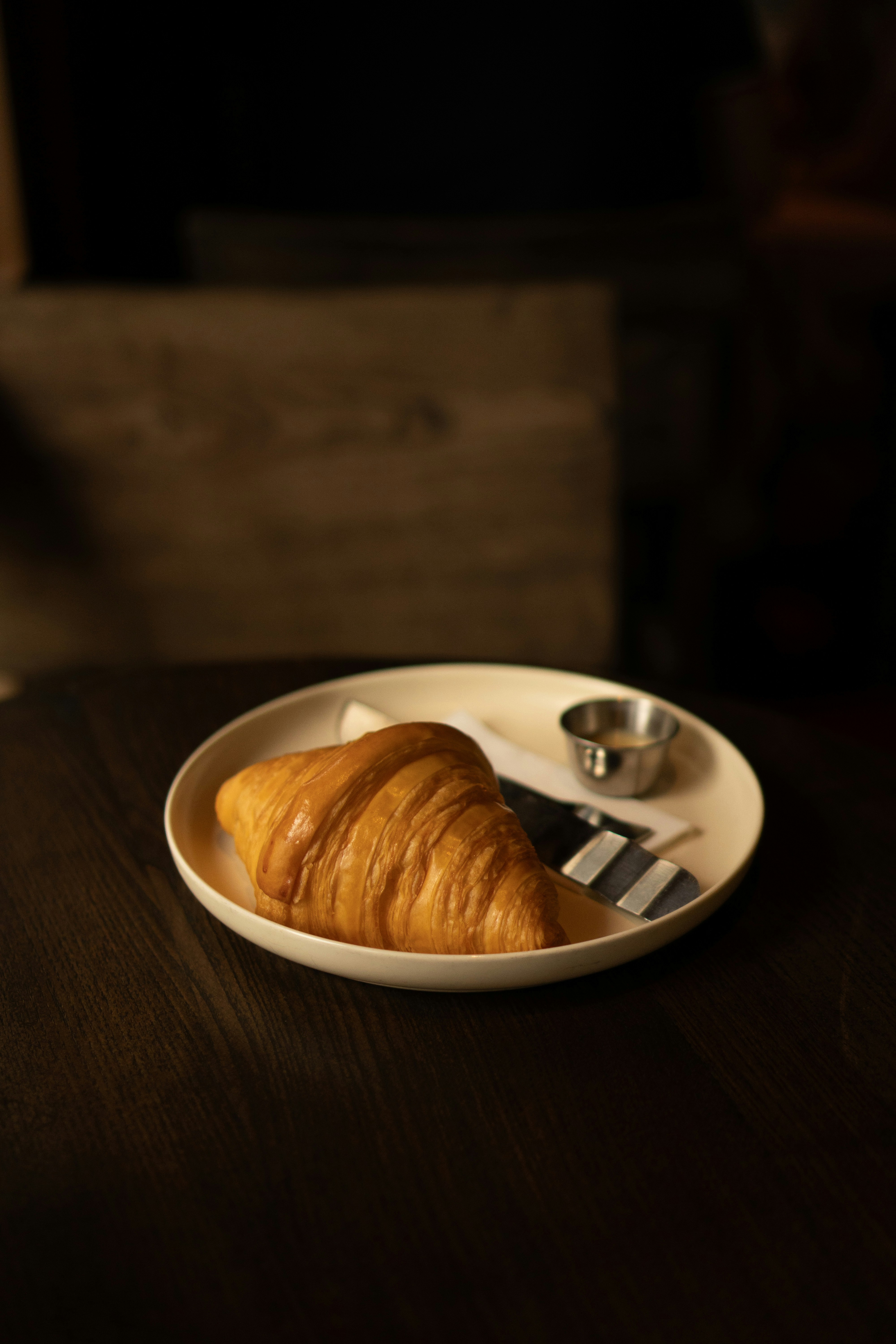 Golden Croissant on a Quiet Table