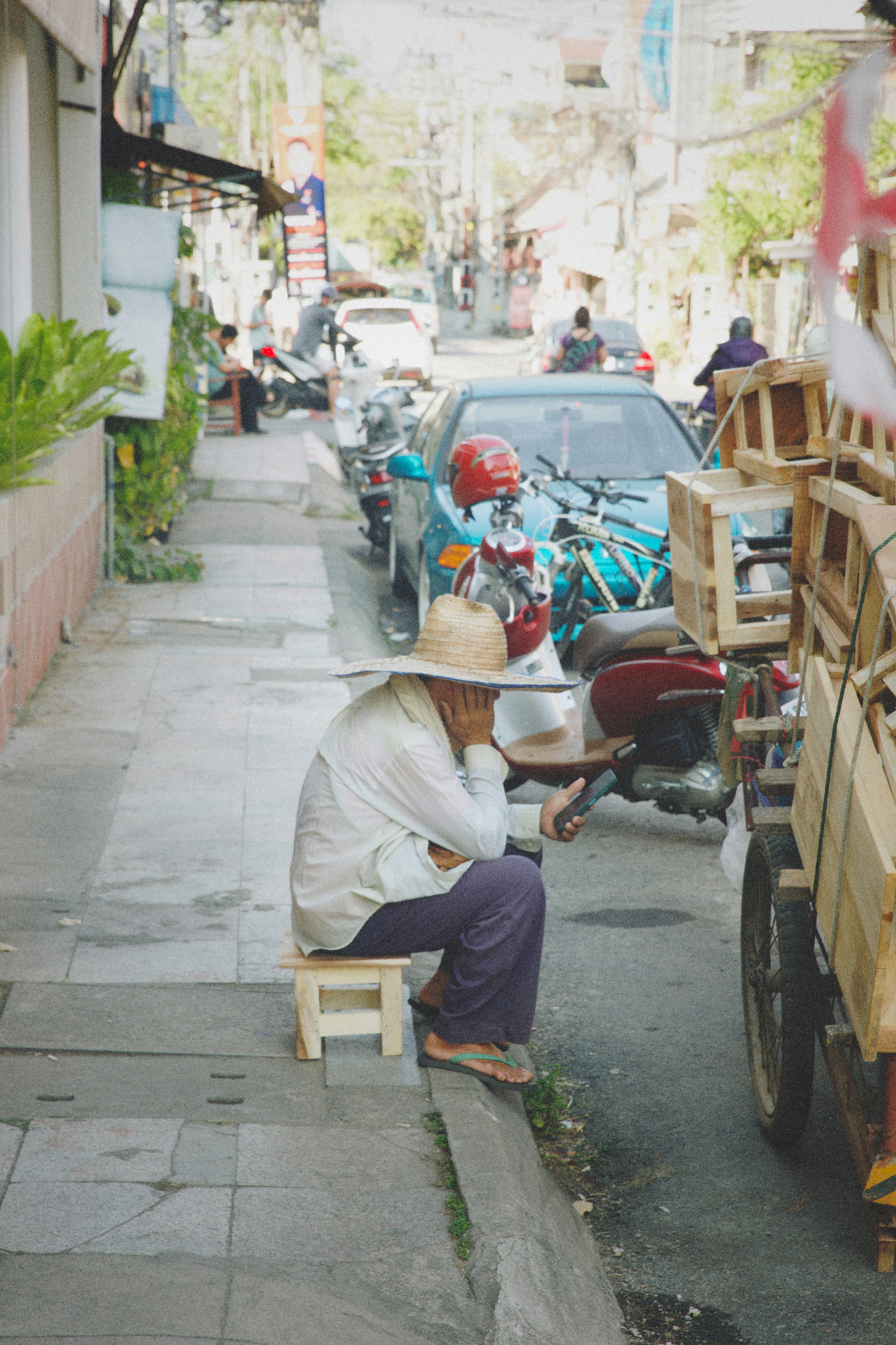 Street-side Portrait: A Elderly Sit-in in Sunlit Alley
