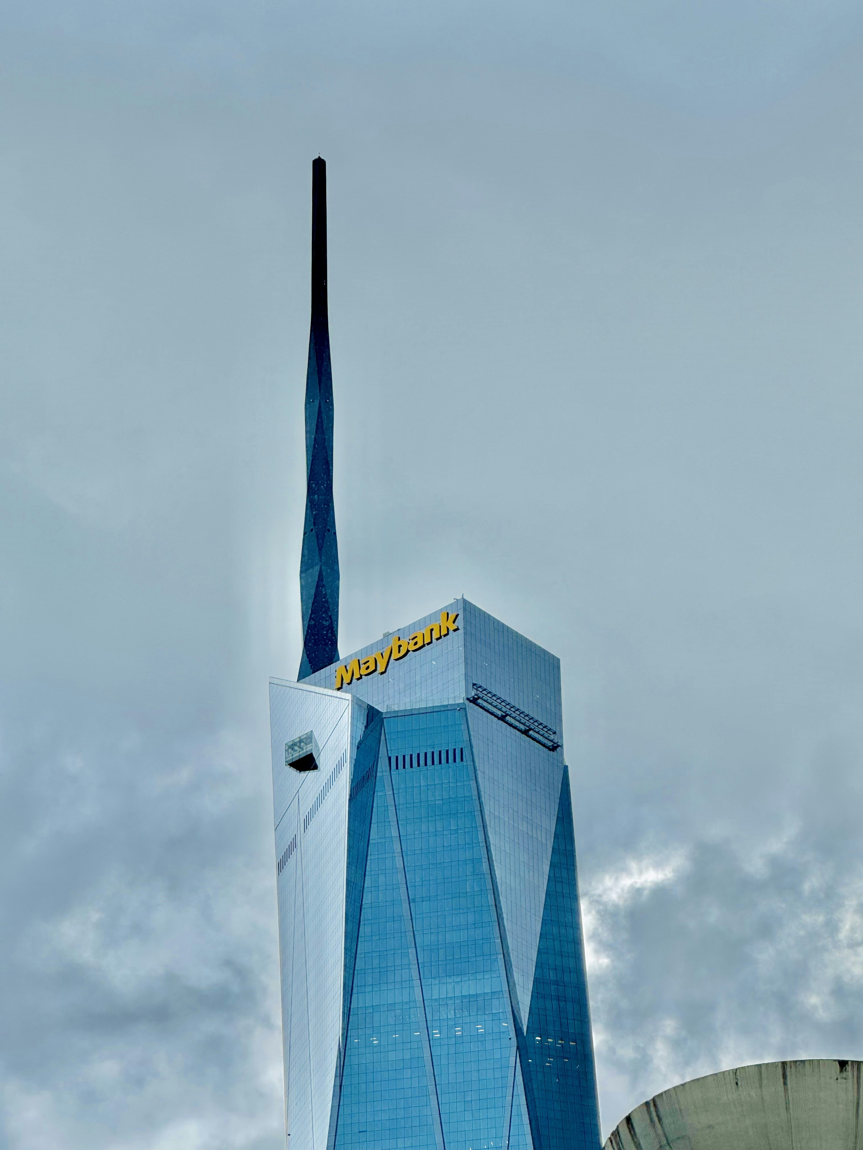 Skyscraper Spear: Maybank Tower Reaching Toward a Misty Sky