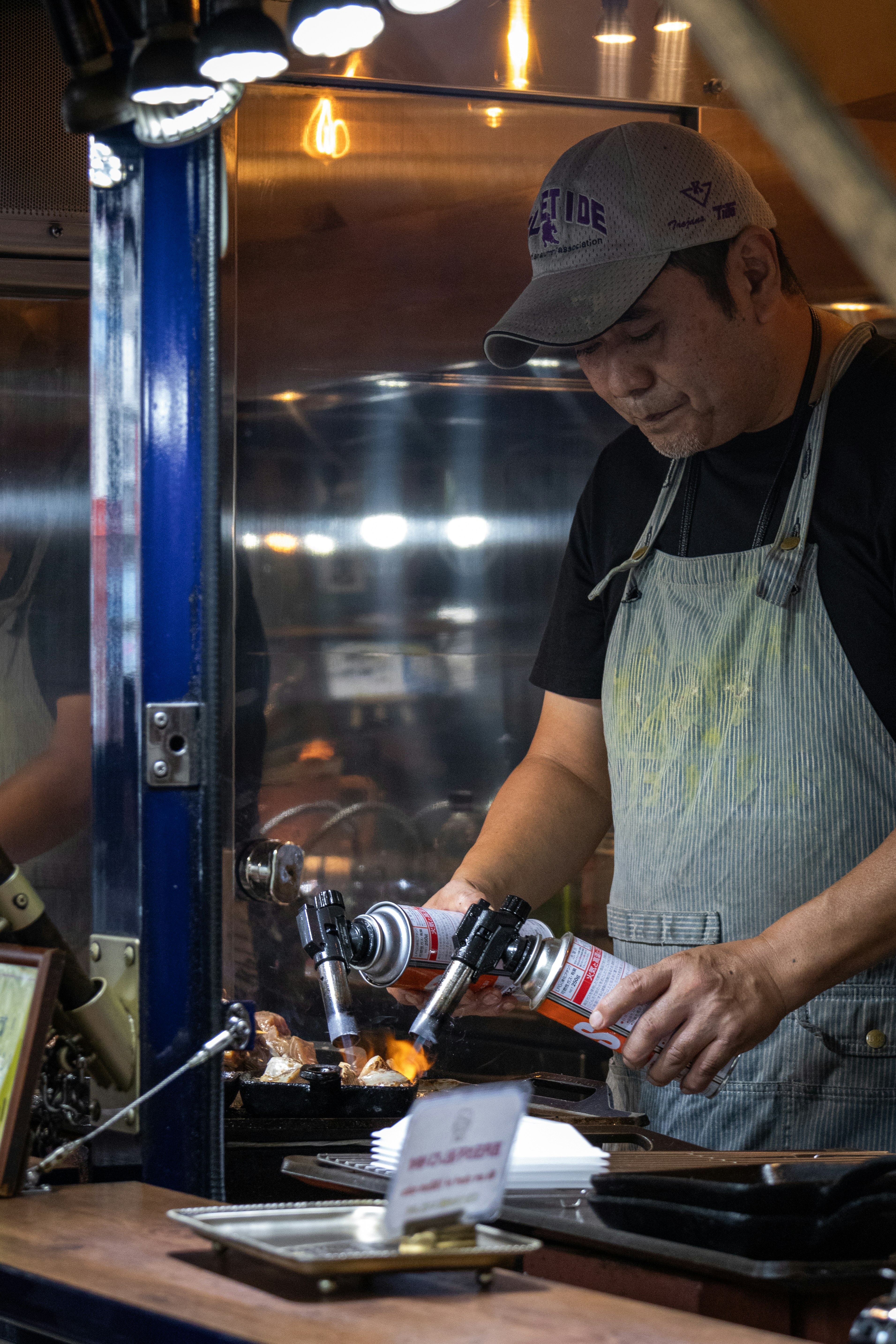 Chef in Action: Flame-Driven Precision at a Street Kitchen Stall