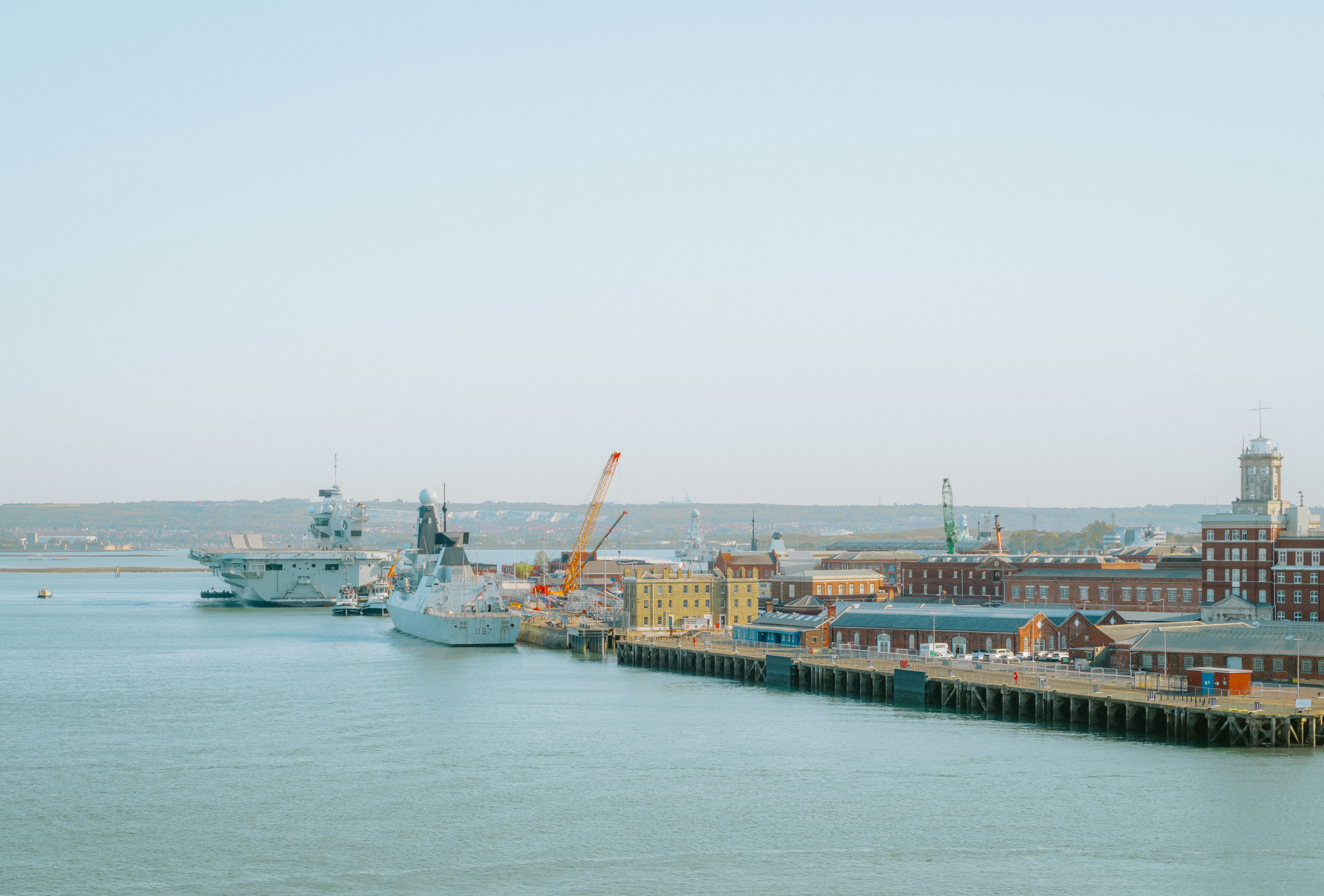 Harbor Workers and Ships at Dawn: A Quiet Waterfront Panorama