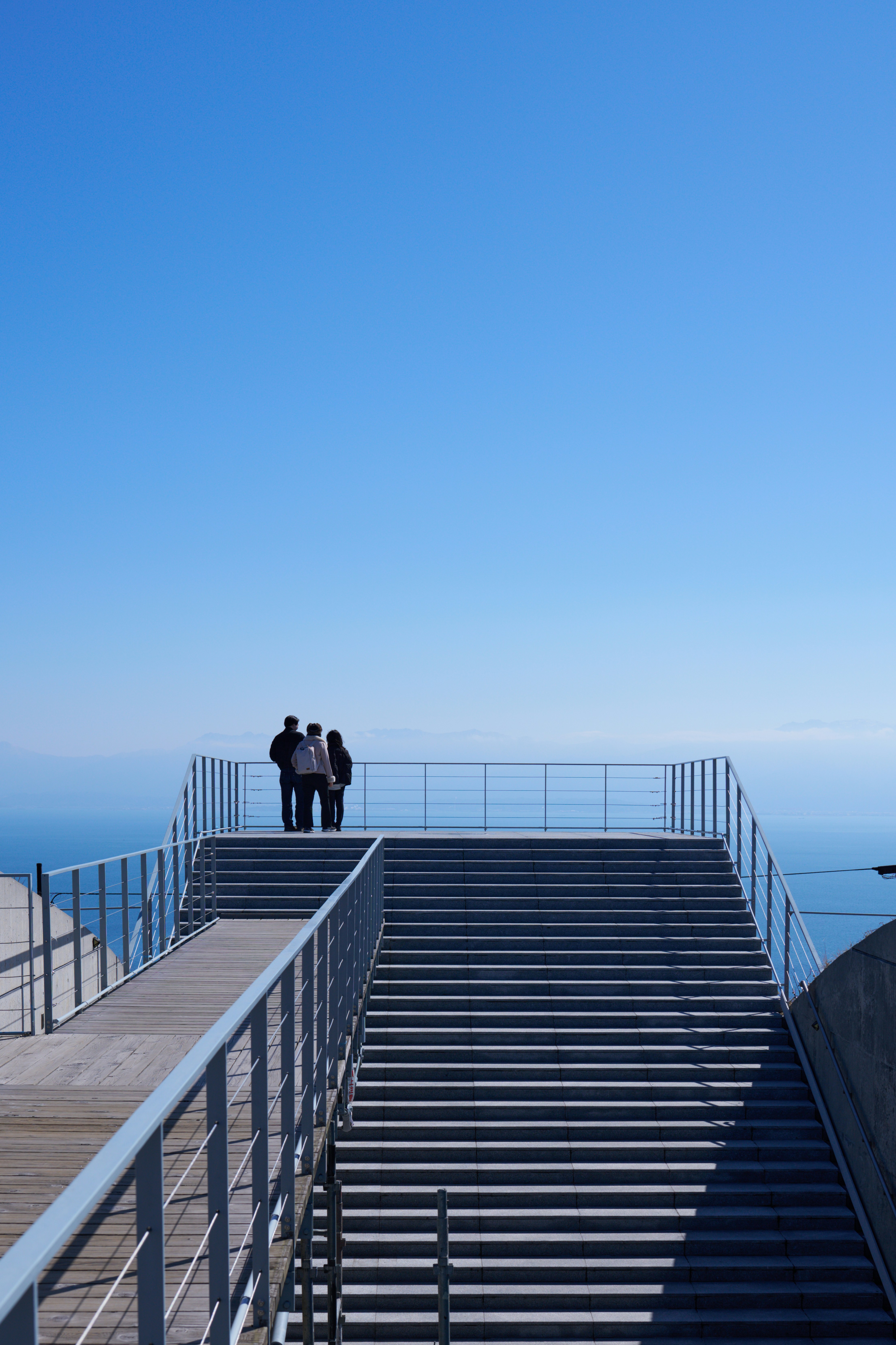 Three Figures at the Horizon: A Staircase to the Sky