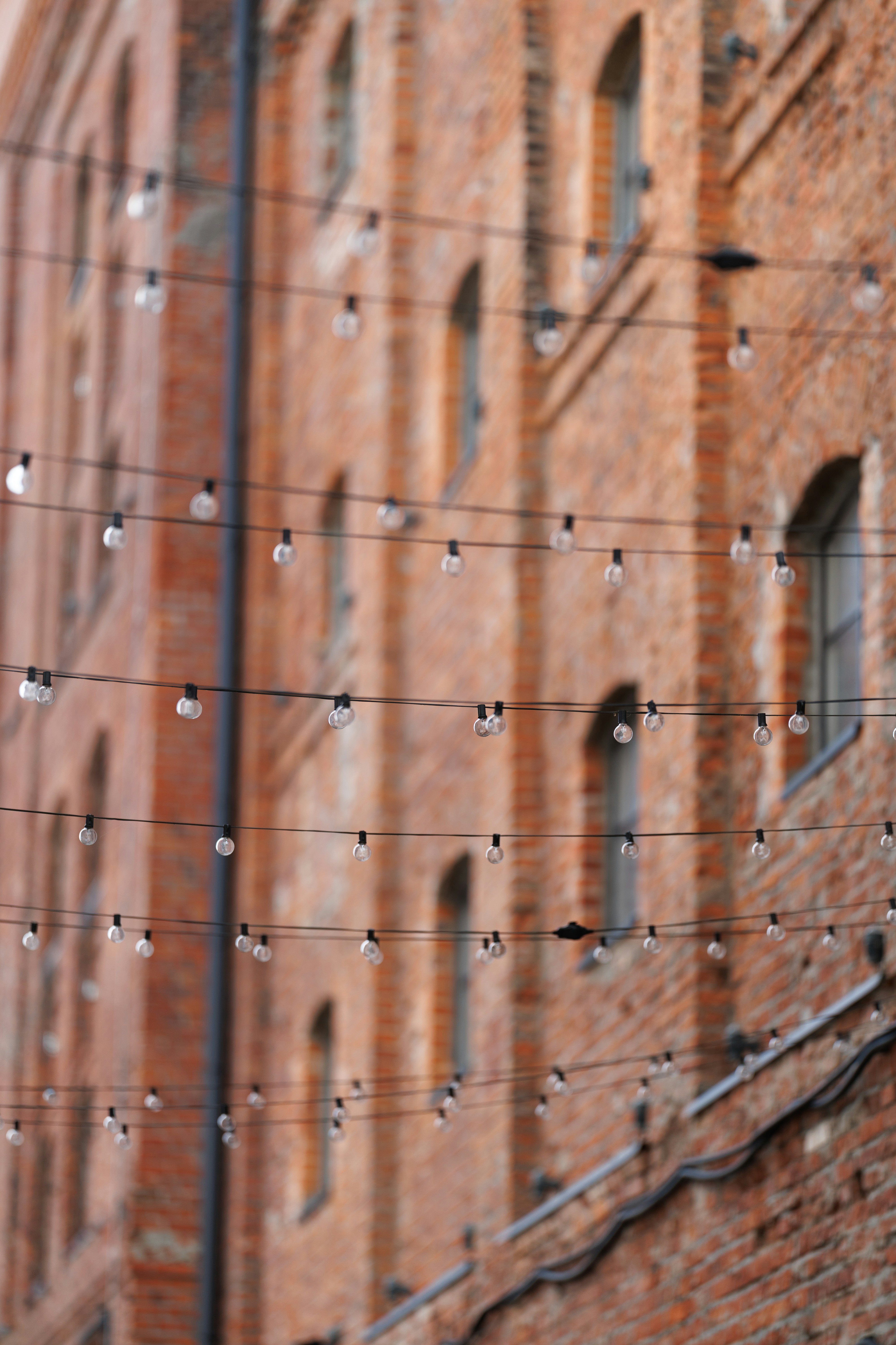 Strings of Light over Bricked Facade