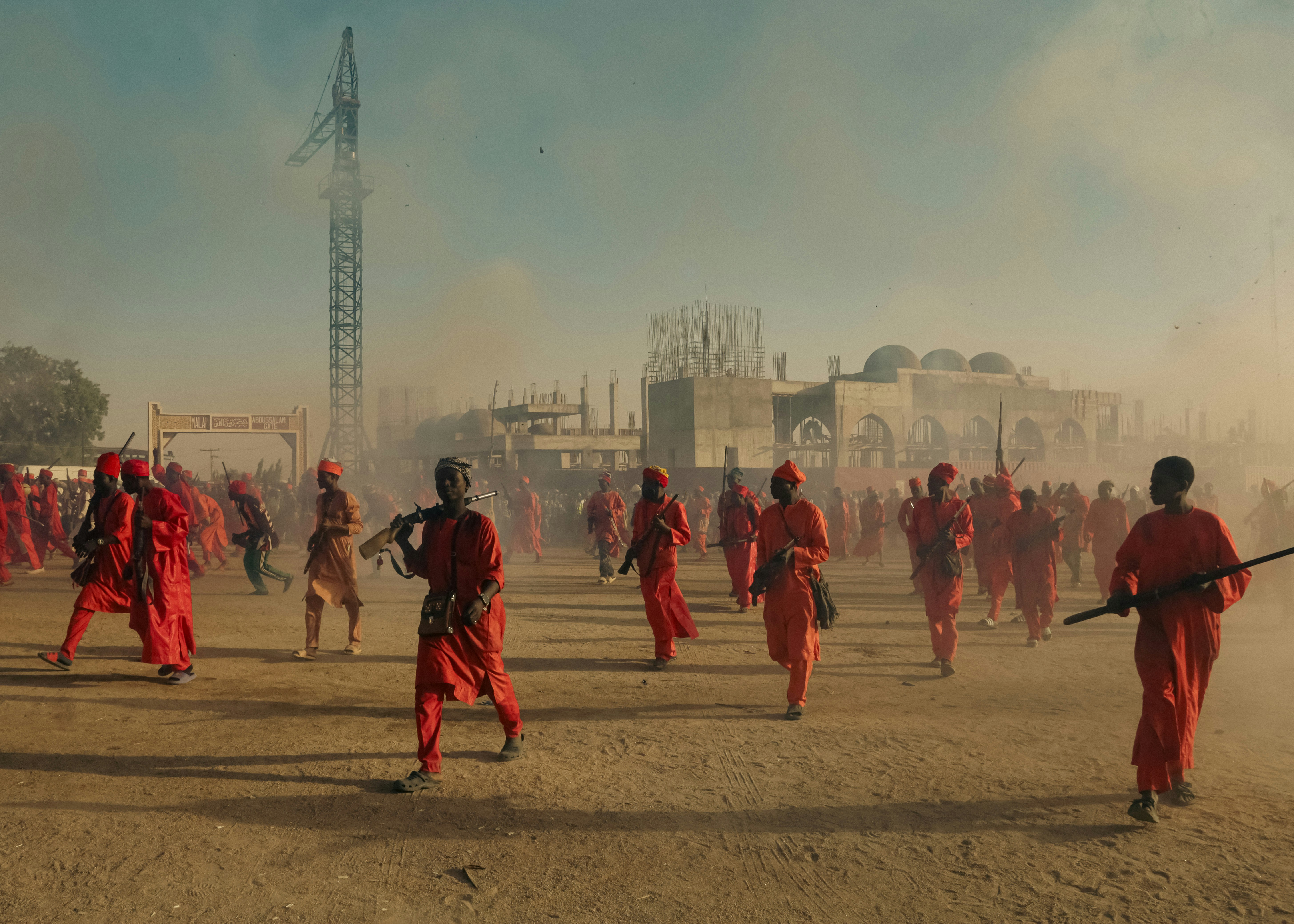 Red Robes at Dusk: A March Through Dust and Noise