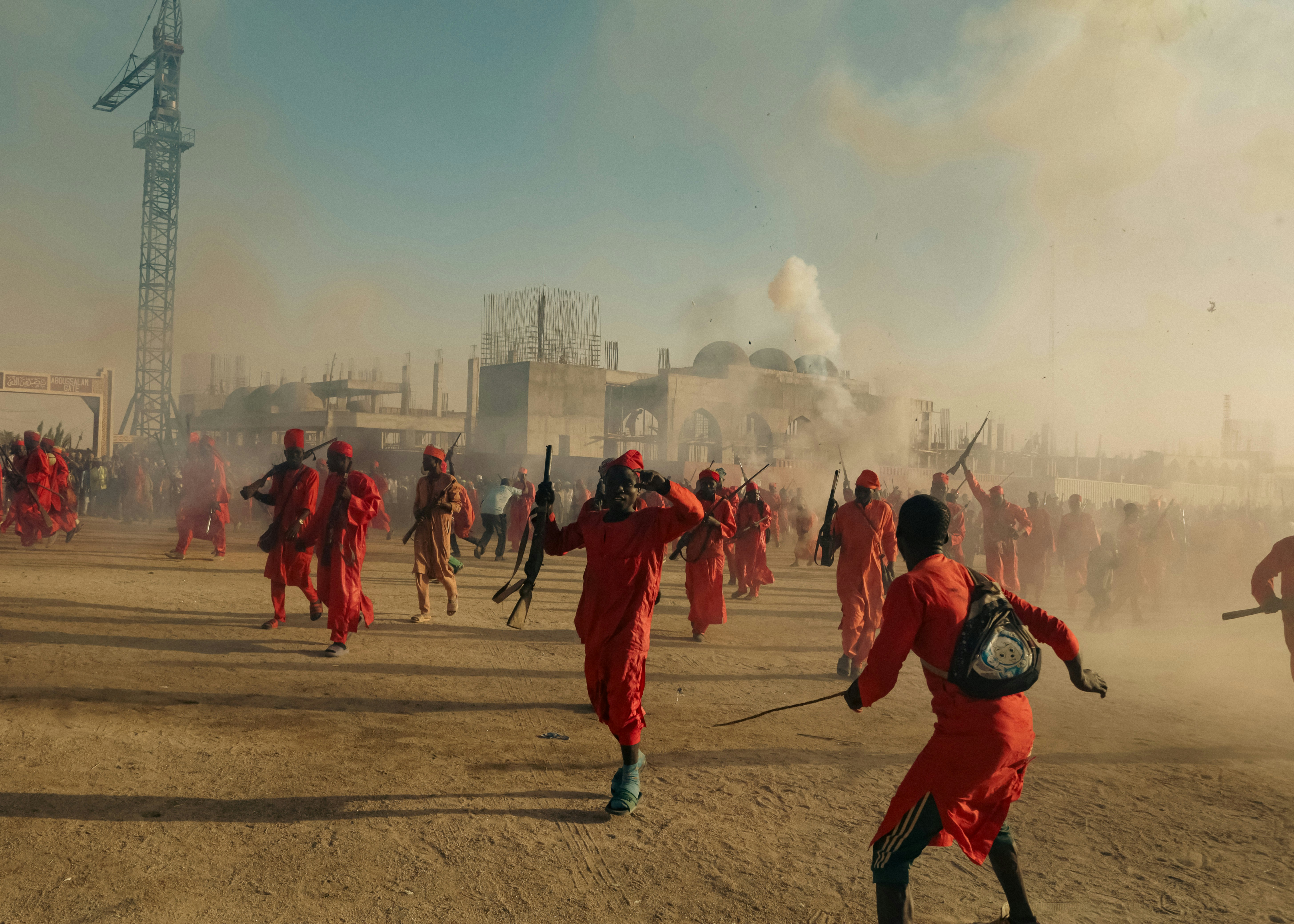 Red Parade in Dust: A Charging Fray at Dawn