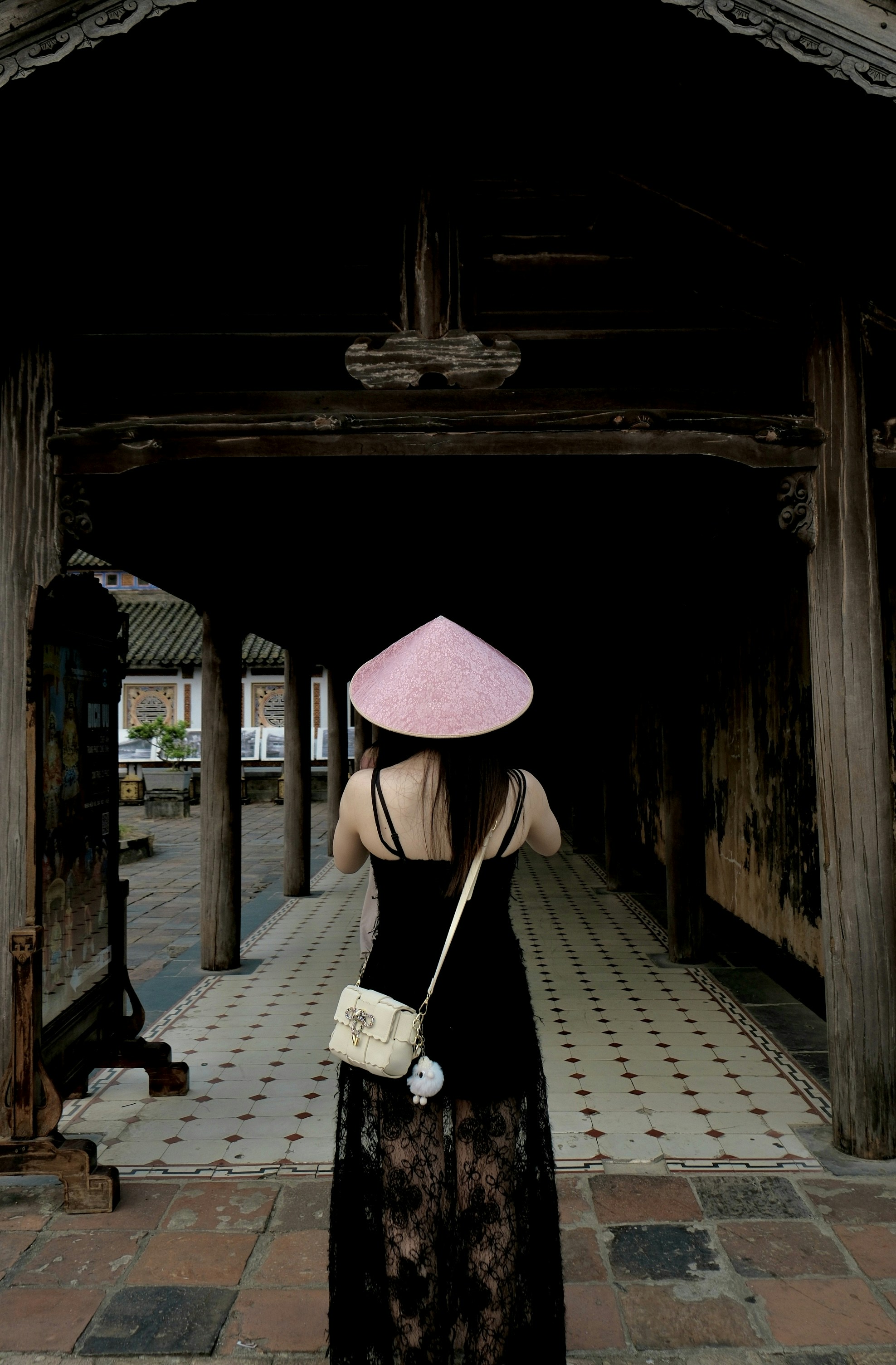 Pink-hatted Mystery: A Back View Through the Archway