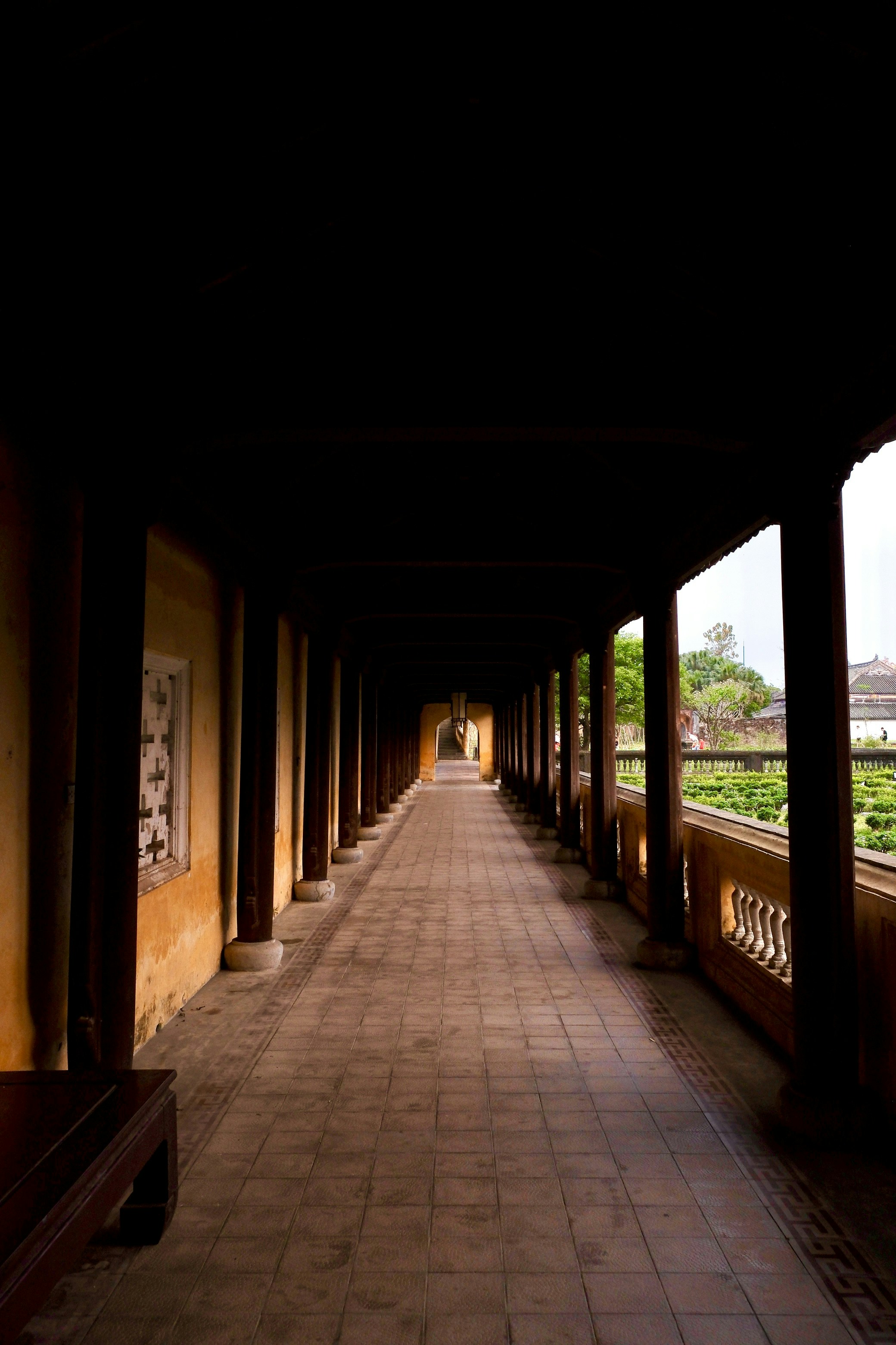 Illuminated Corridor: A Sunlit Travel Through the Cloistered Walkway
