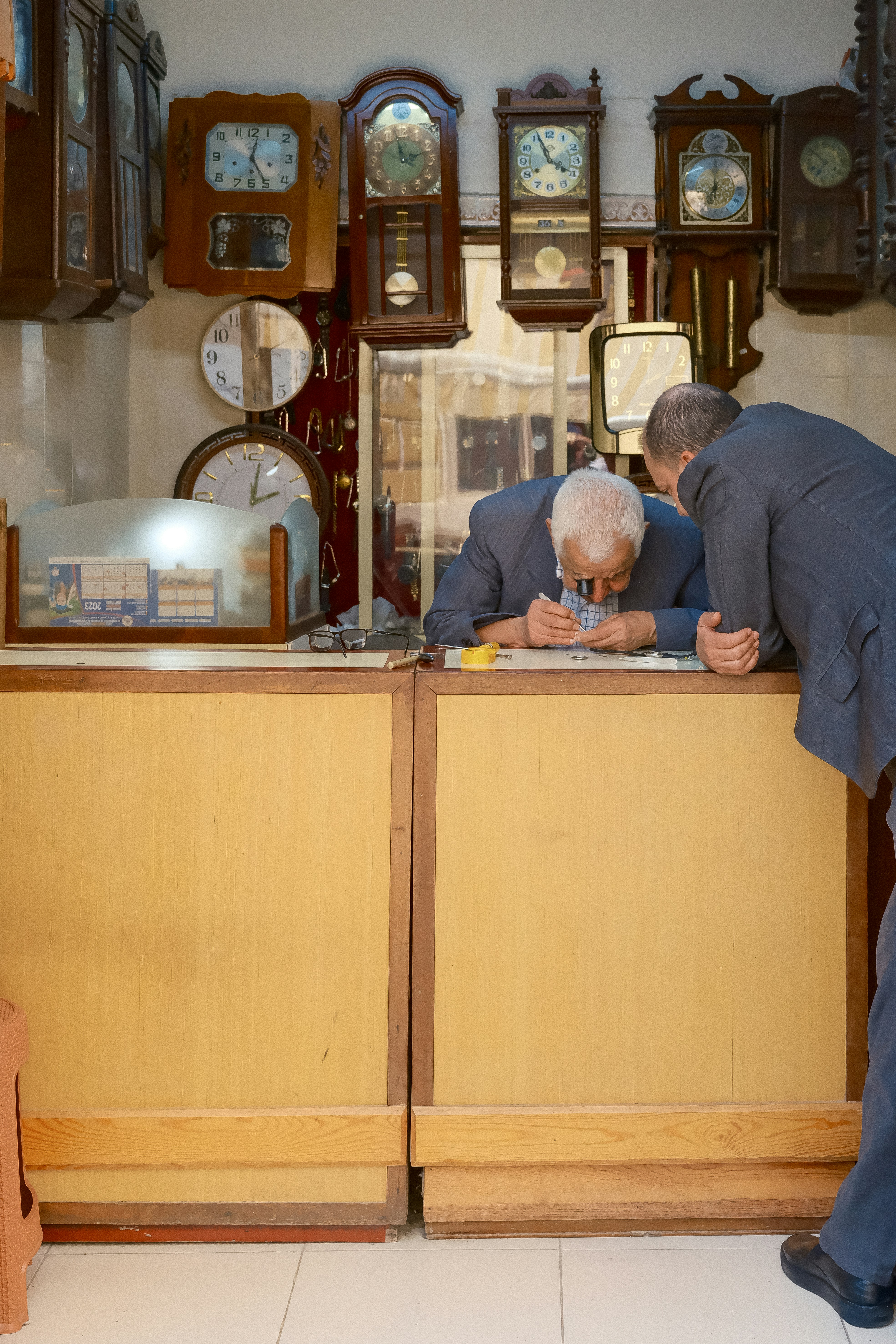 Traditional clockmaker workshop in the medina of Tangier, Morocco, where artisans repair vintage clocks