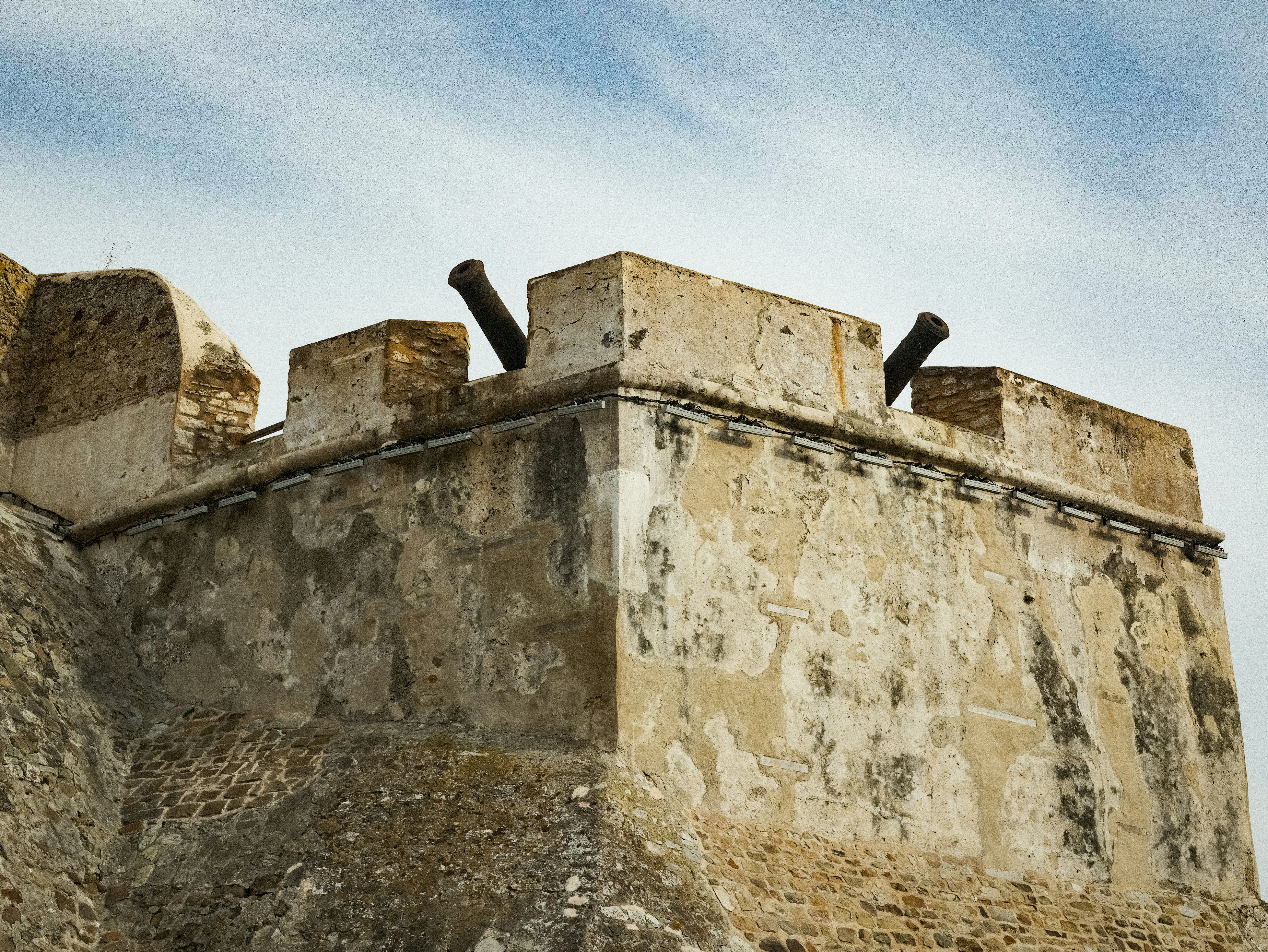 Historic fortifications in Tangier, Morocco, with old cannons overlooking the city, reflecting the military and maritime heritage of North Africa.