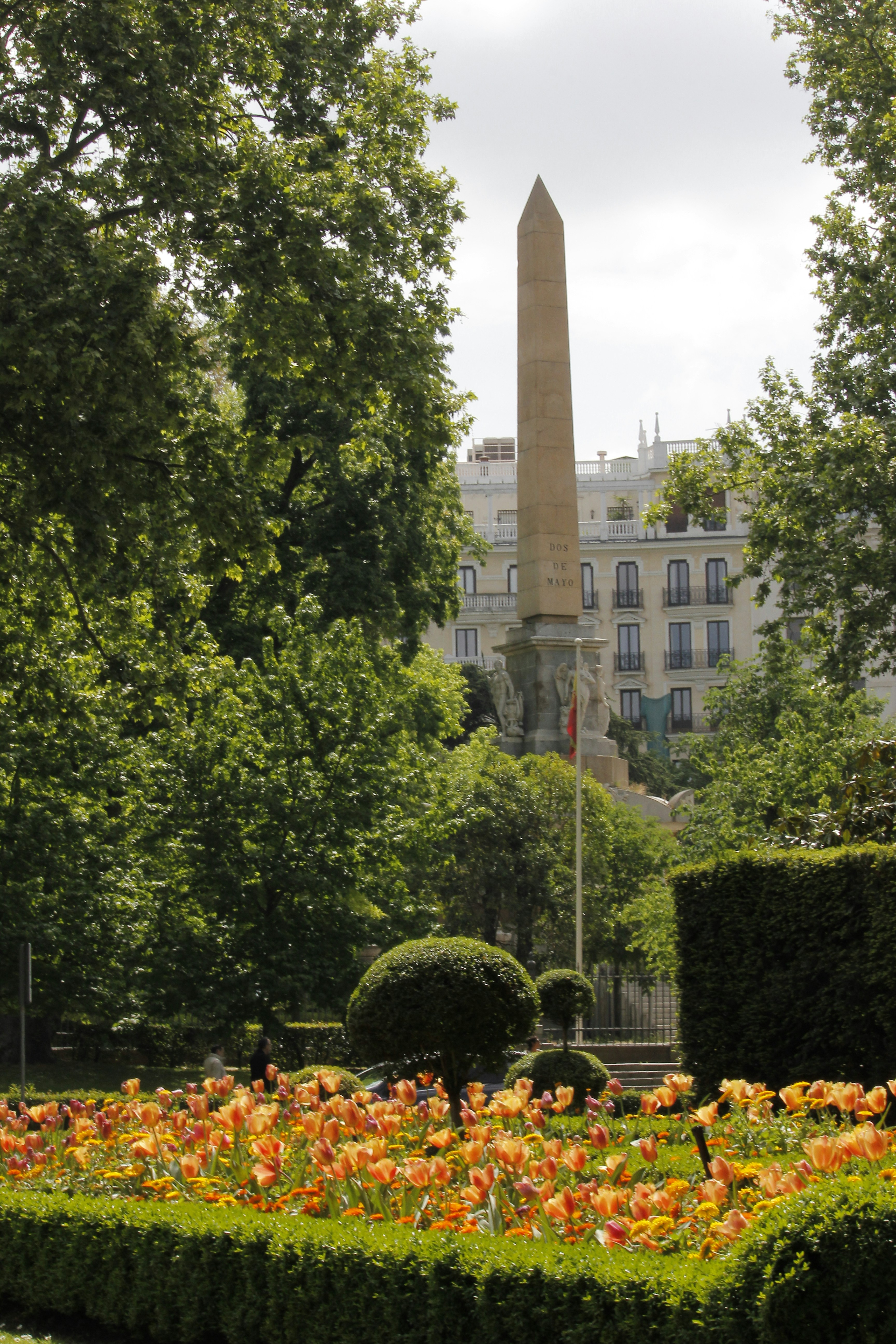 Obelisk in a Sunlit Garden Frame