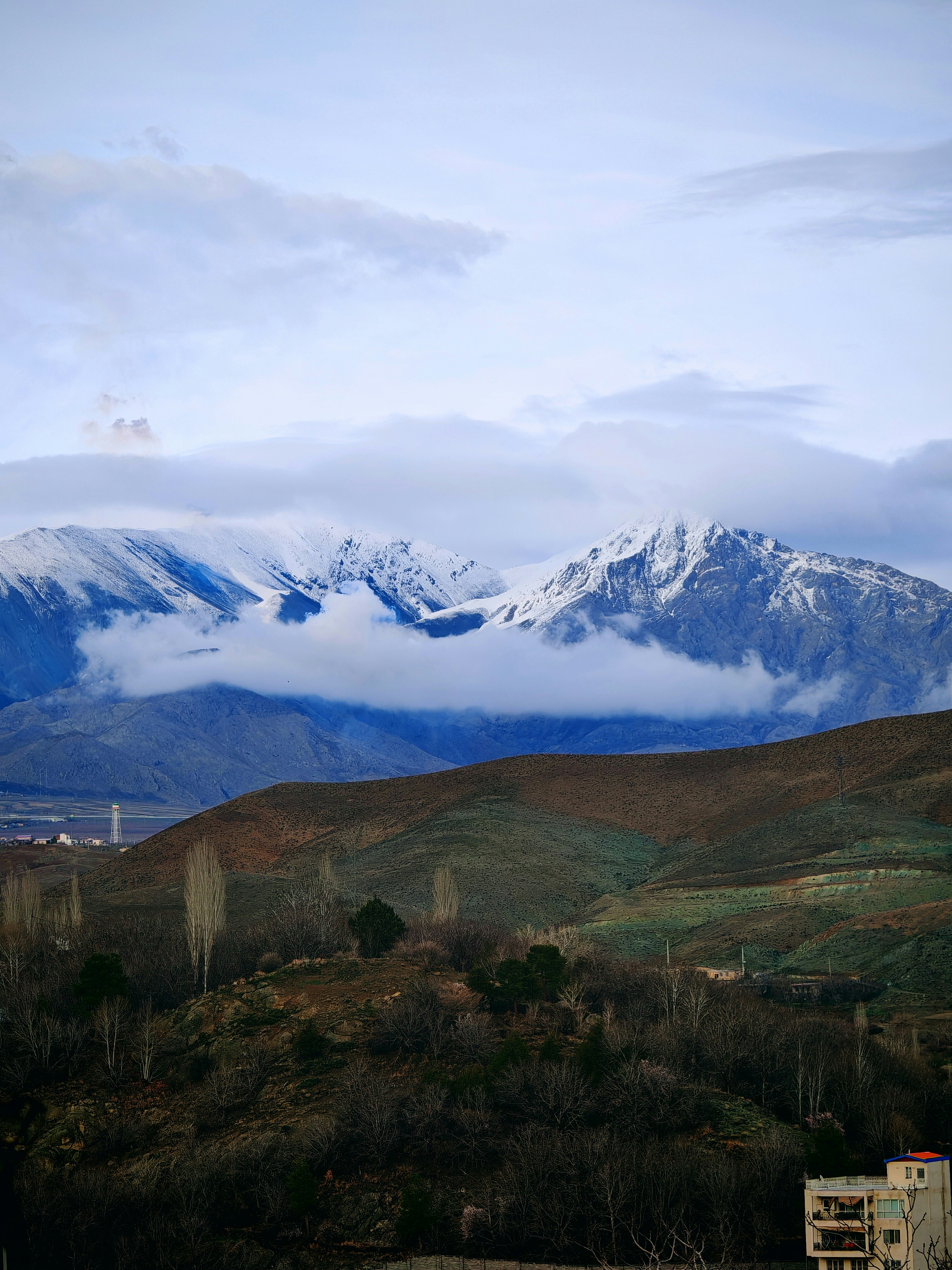 Snow-kissed Peaks Breathe Above a Quiet Valley