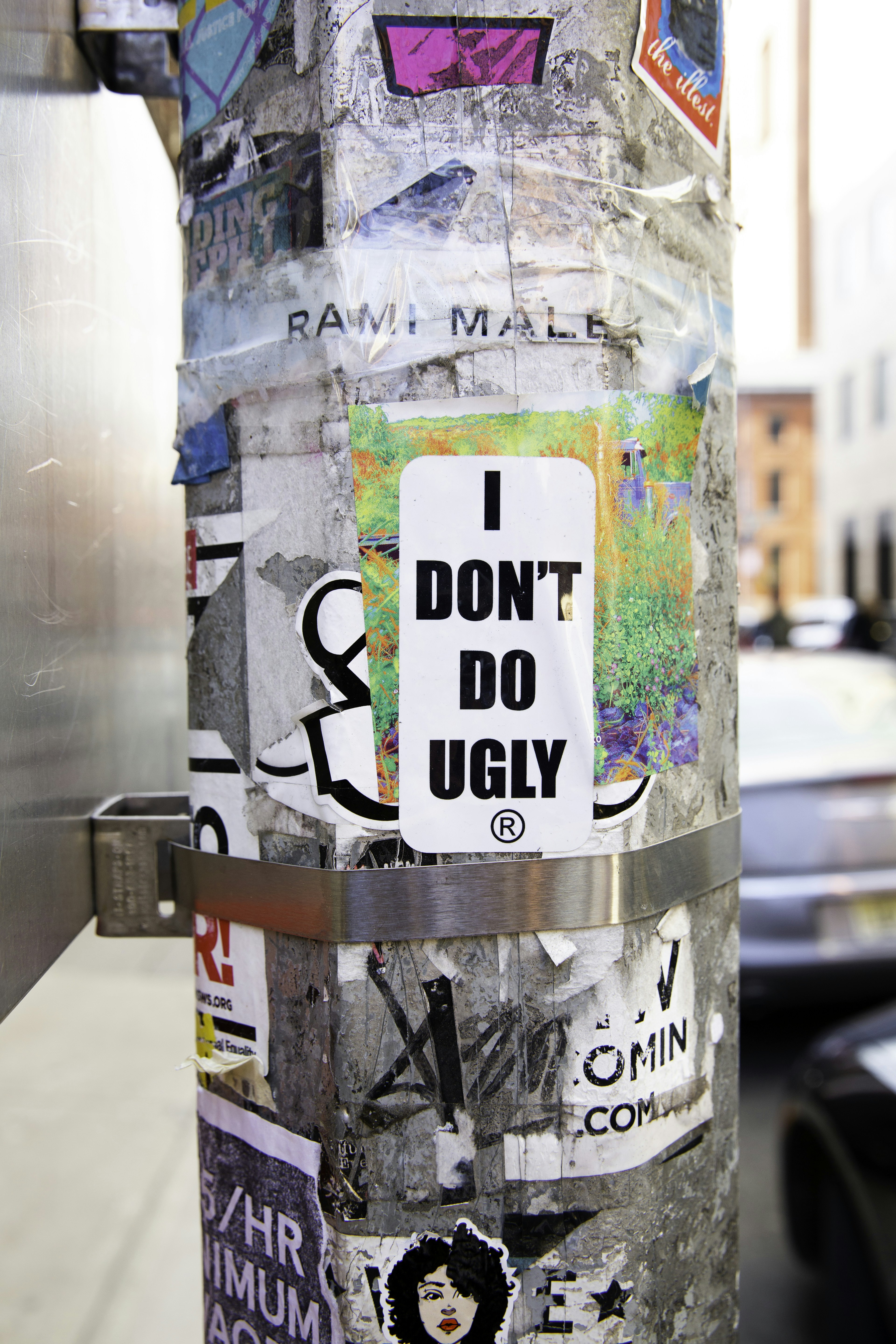Streetside Sticker Stack: Don’t Do Ugly on a Weathered Pole