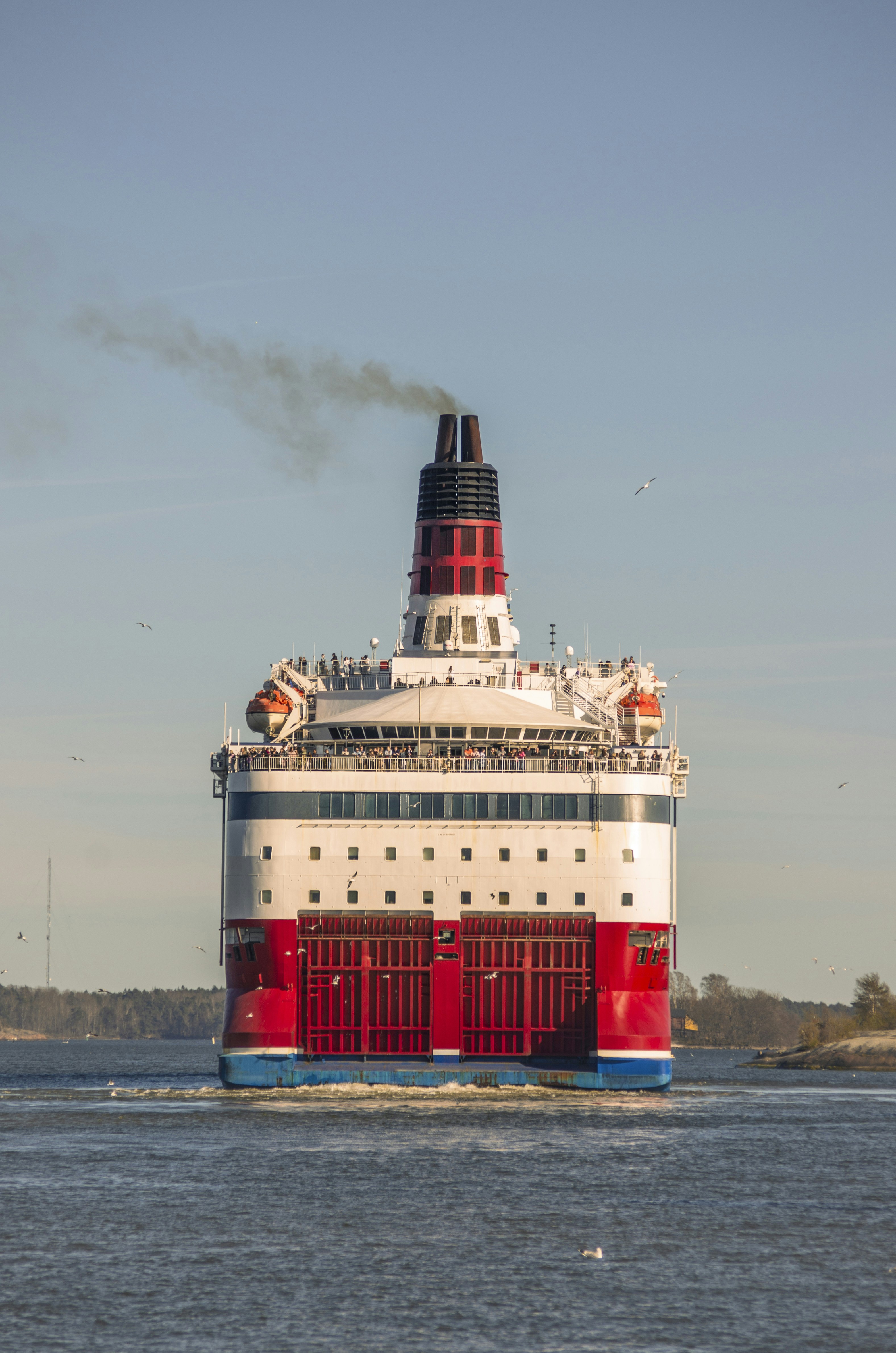 Red and White Ferry Piercing Quiet Waters