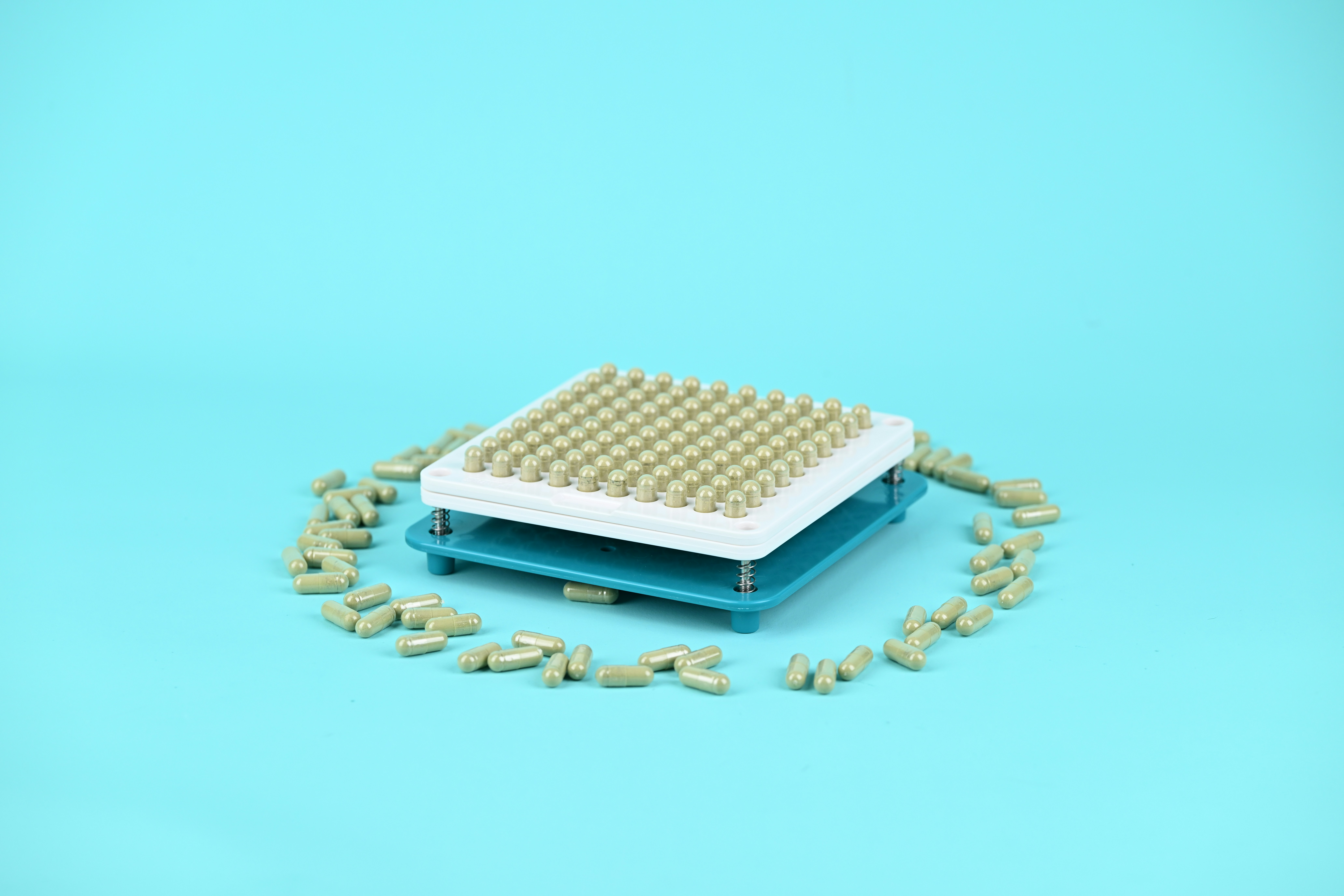 A Quiet Stack: Pixel Grid Resting on a Blue Bed