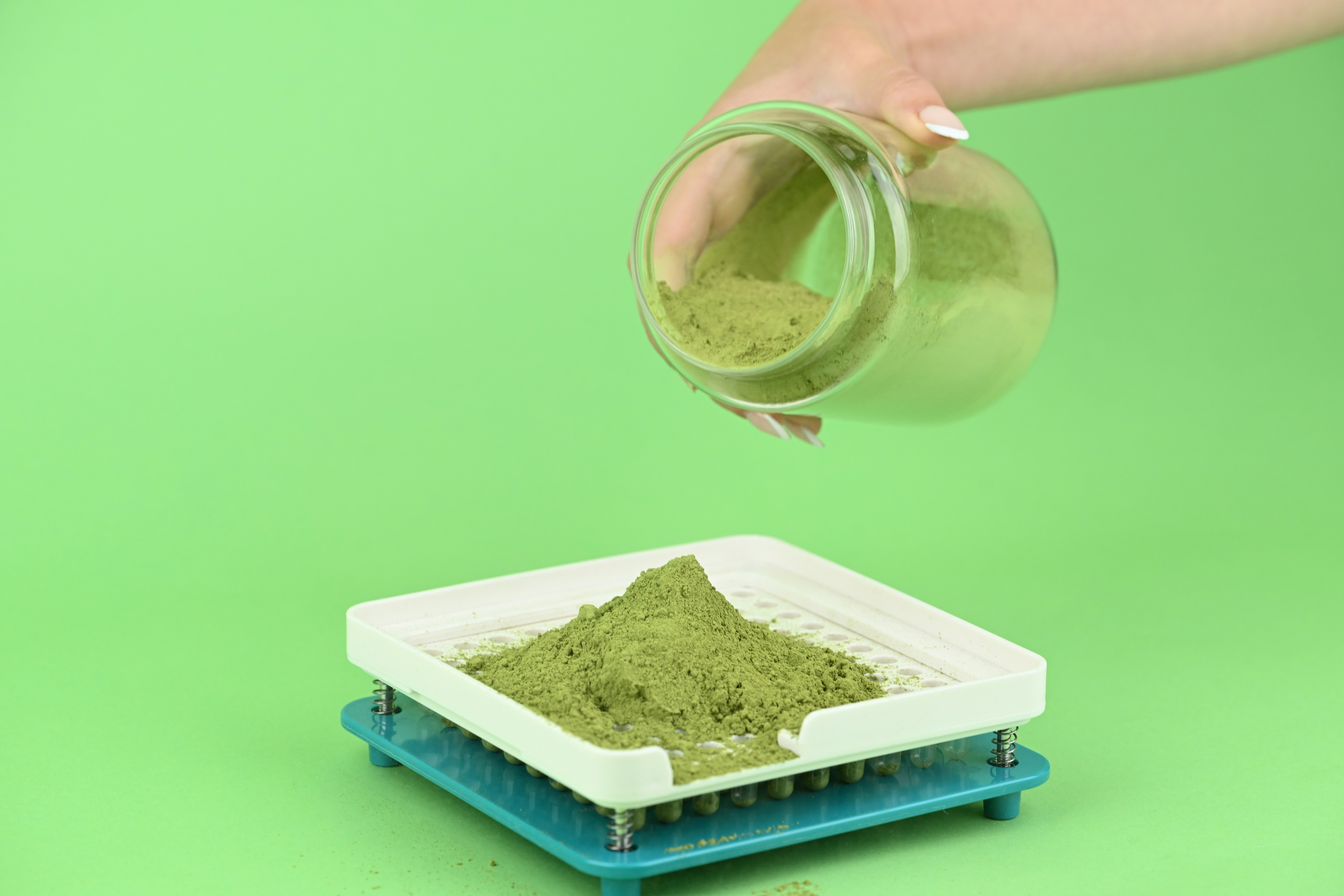Glowing Green Sand Dispenser: Pouring Into a Mold