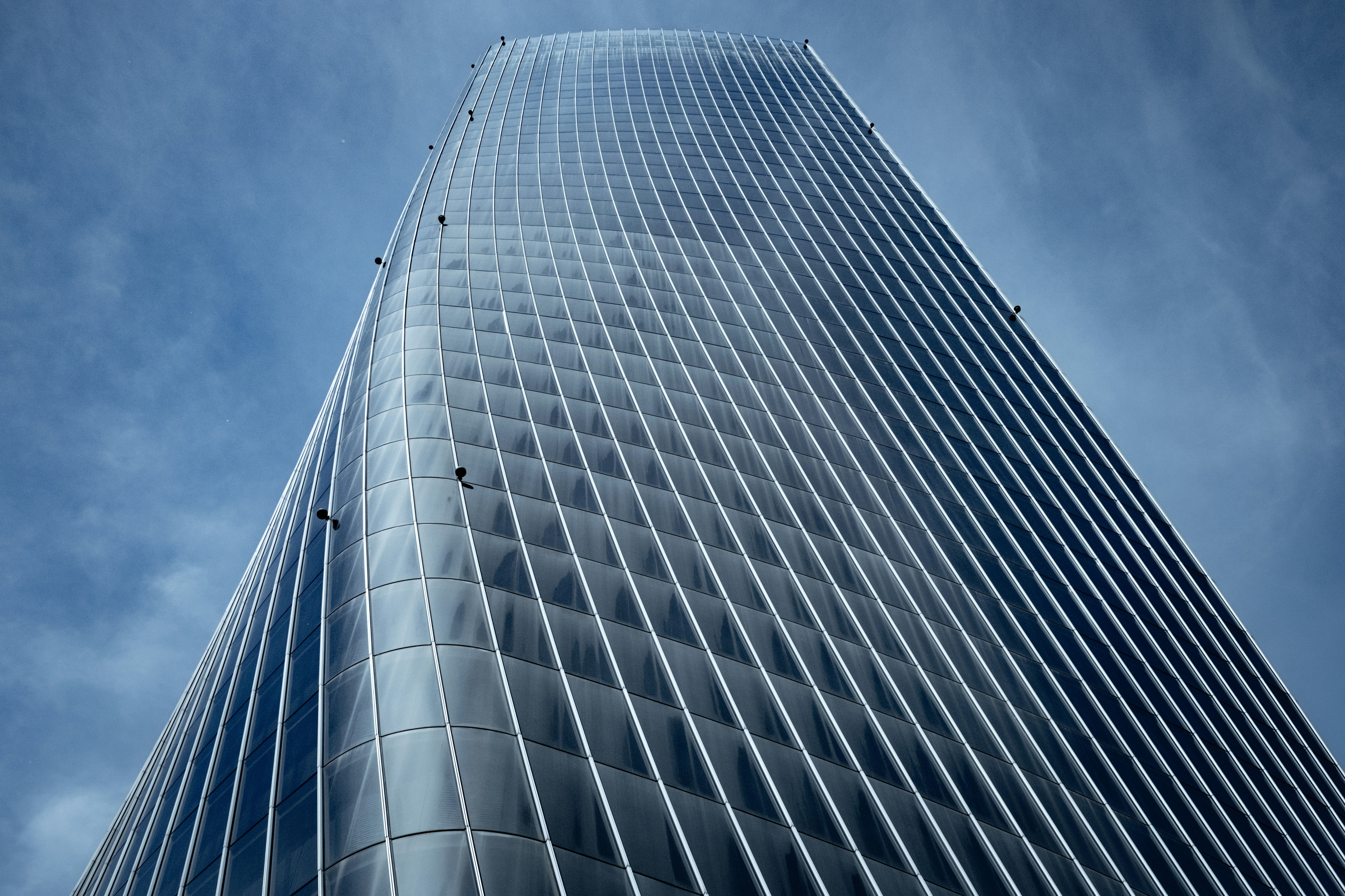 A Towering Facade: Glass Ribbons Reaching the Sky