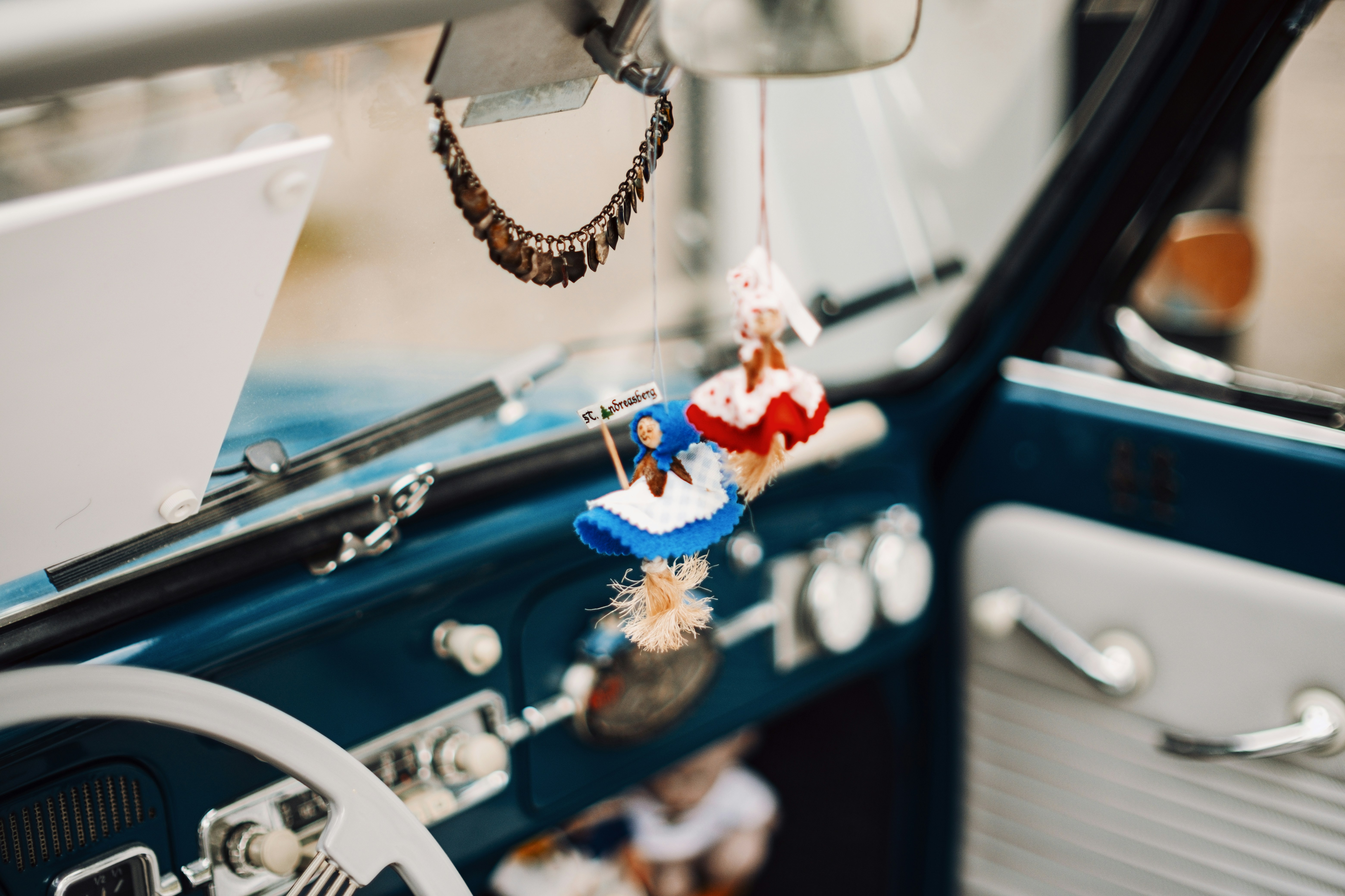 Vintage Blue Cabin: The Car's Quiet Interior with Hanging Ornaments