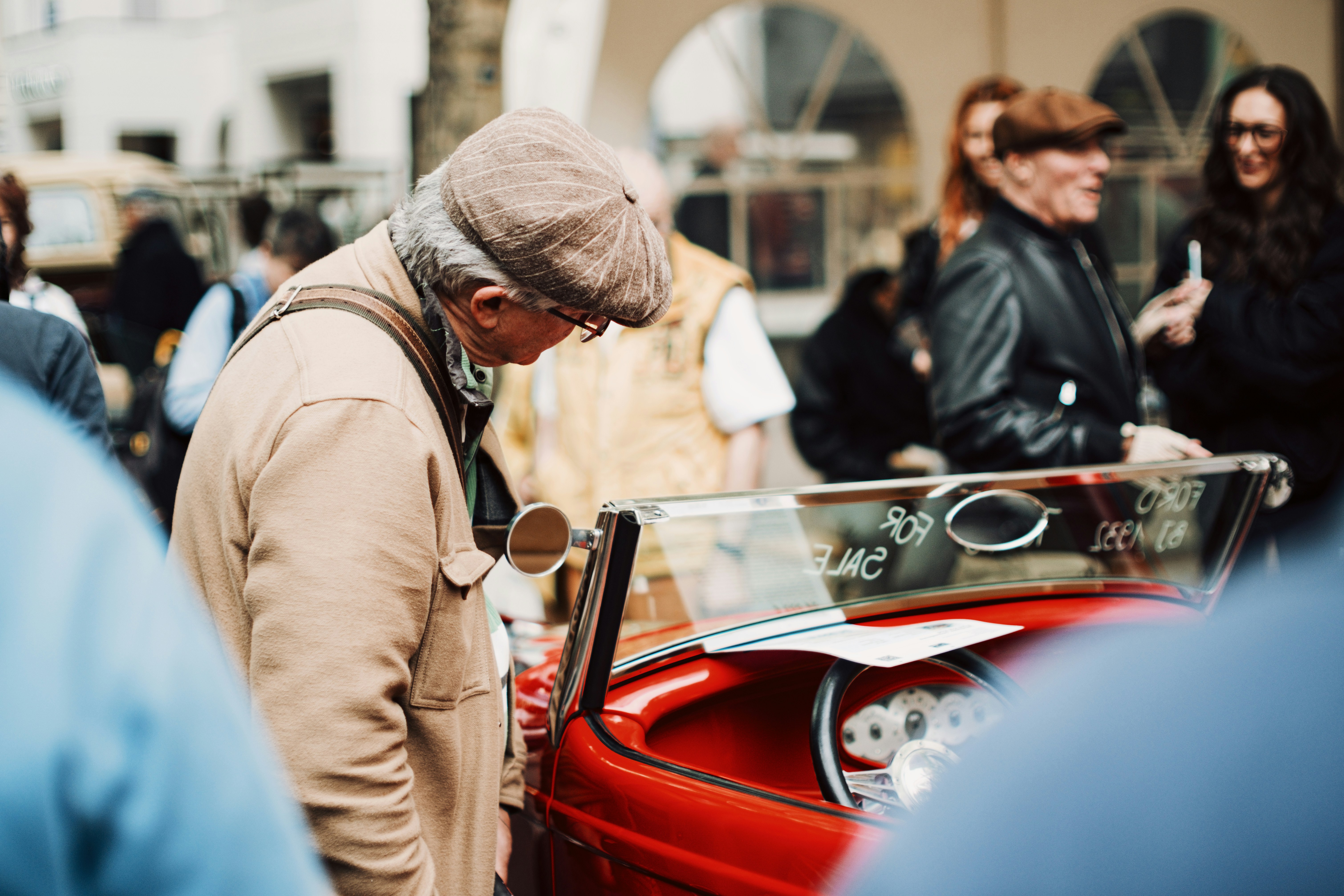 Old hat, new gleam: a quiet moment with a vintage red car centerpiece
