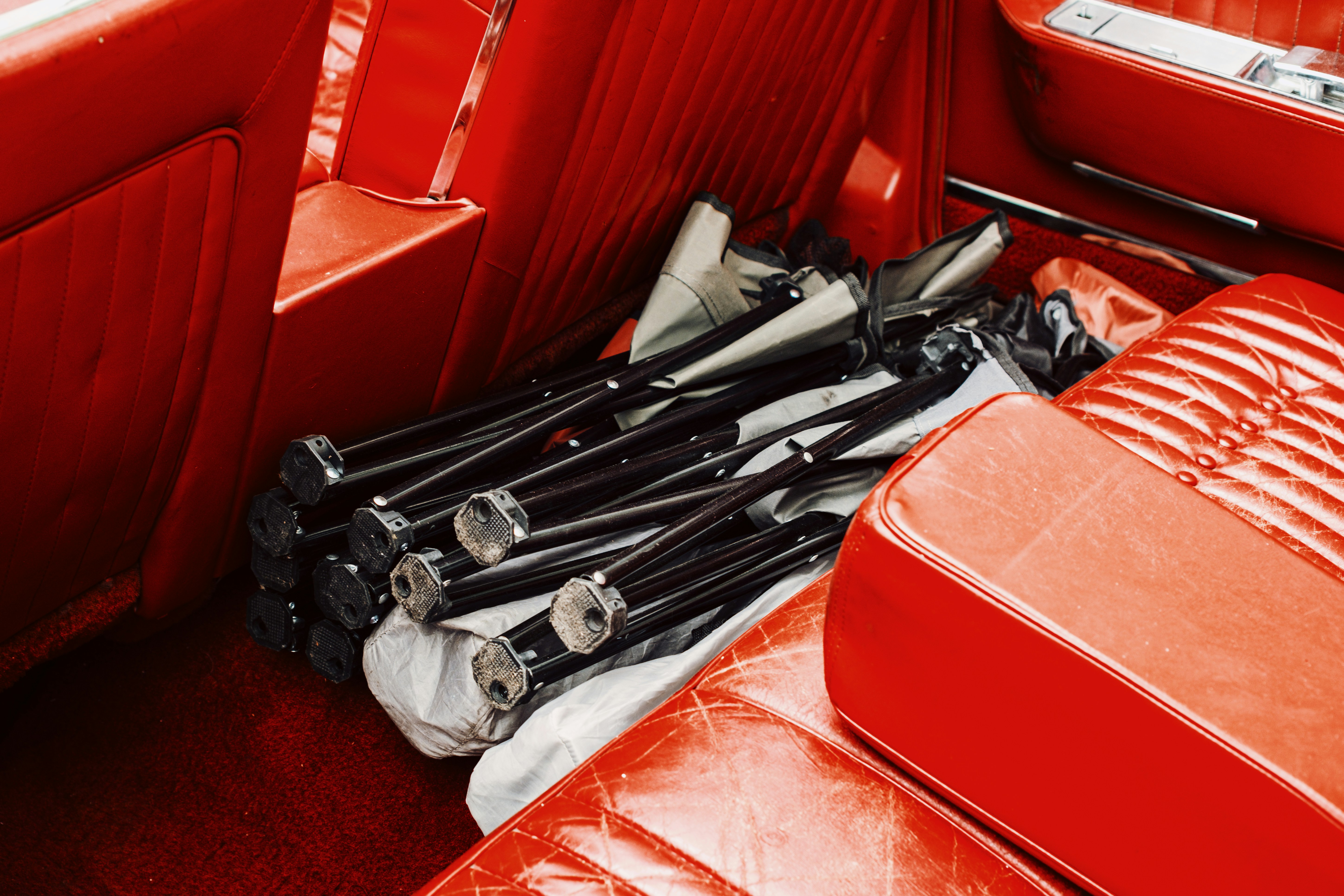 Red Interior, Hidden Tools: A Quiet Car Compartment
