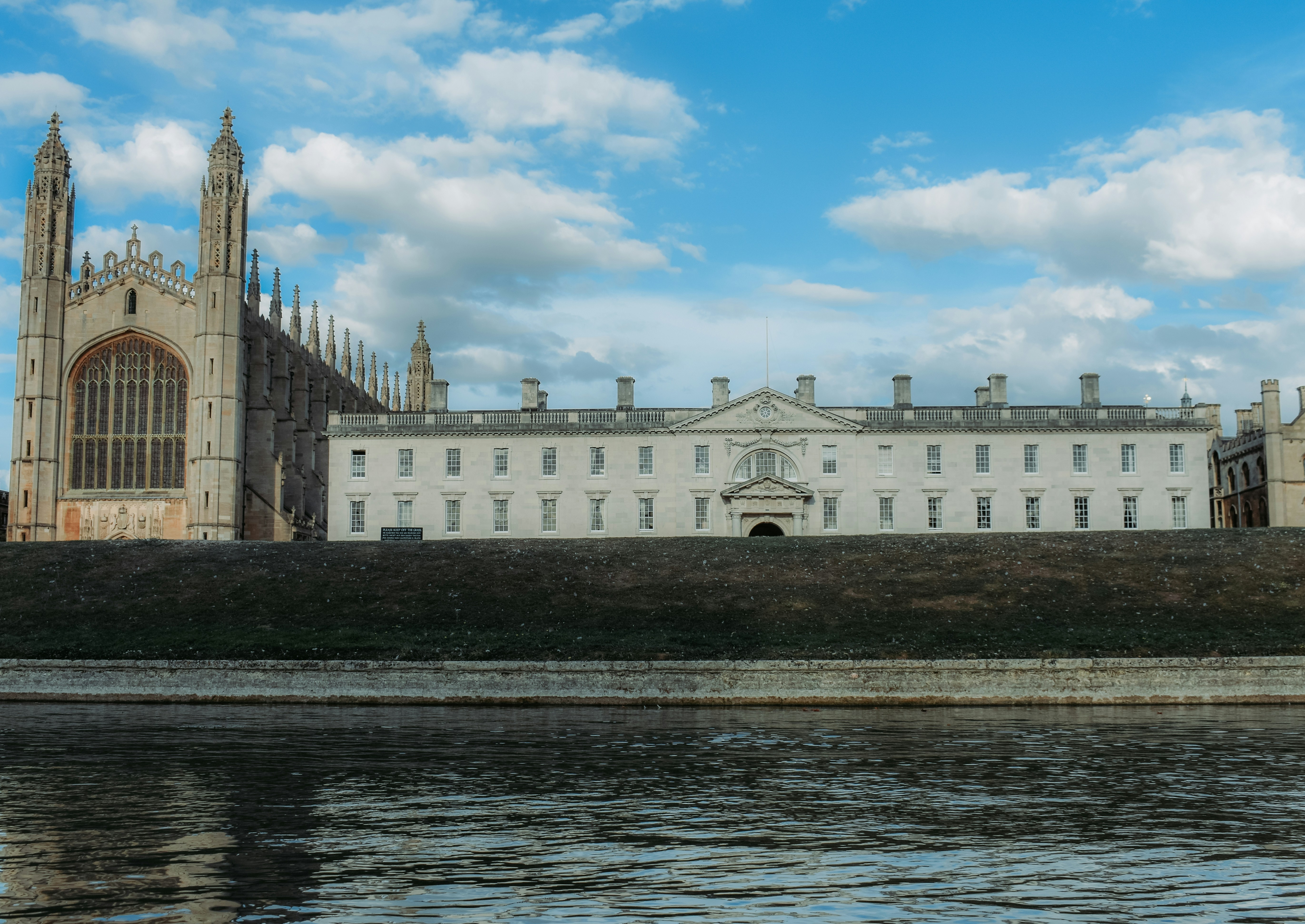 Harbor of Stones: Riverside Wing Framed by Gothic Towers