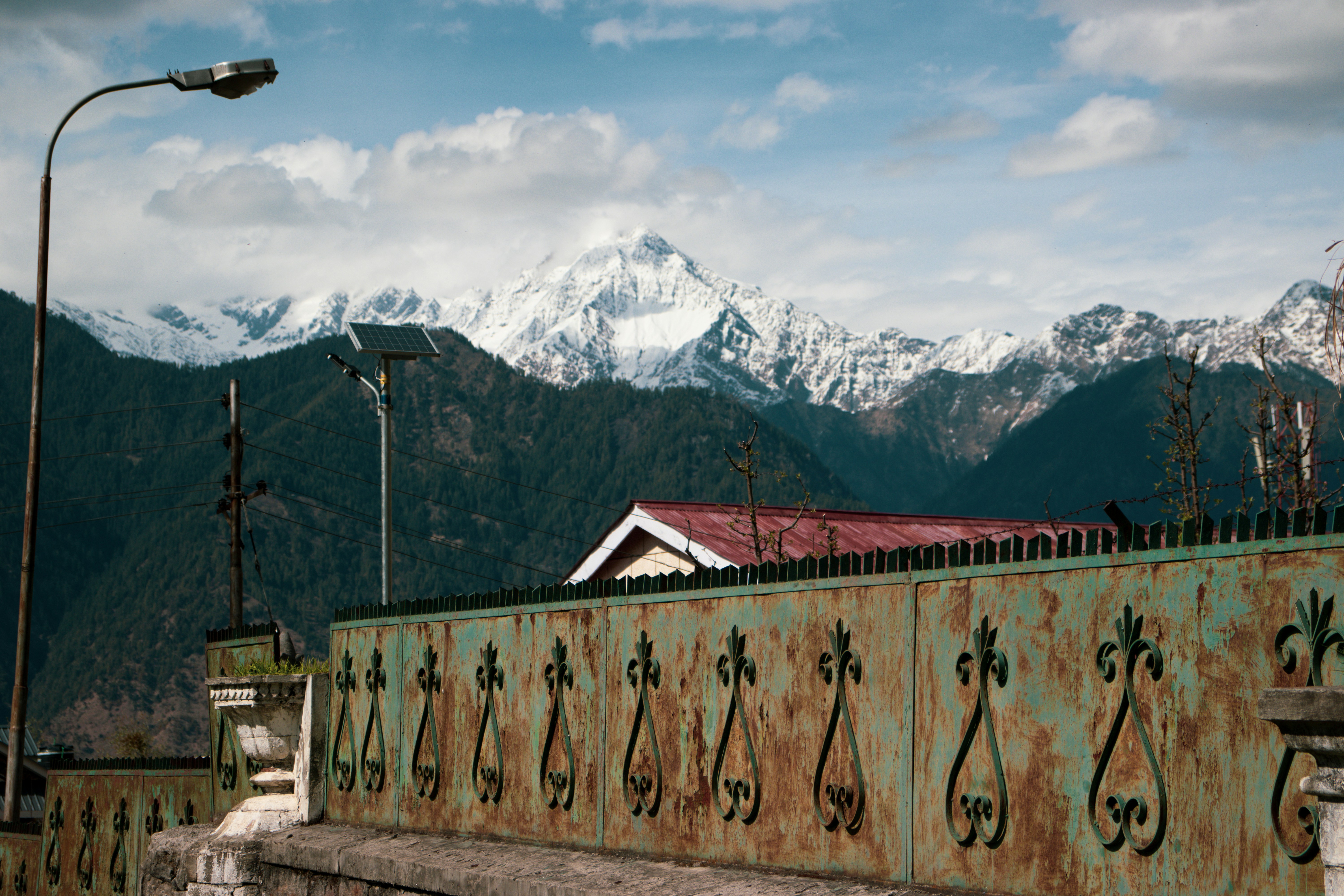 Snowy Peak Over a Weathered Terrace