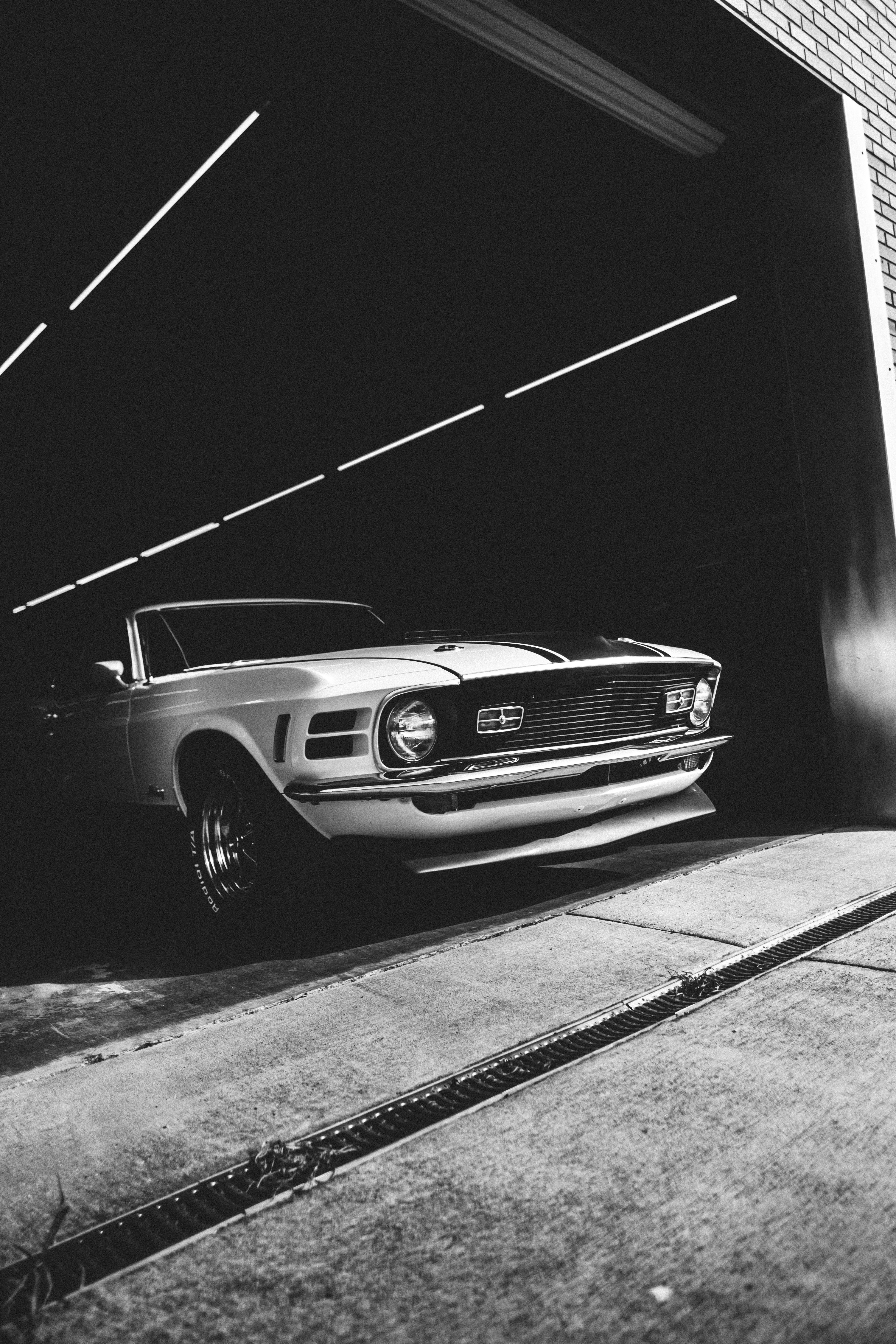 Midnight Chrome: A Classic Car Housed in Shadowed Garage