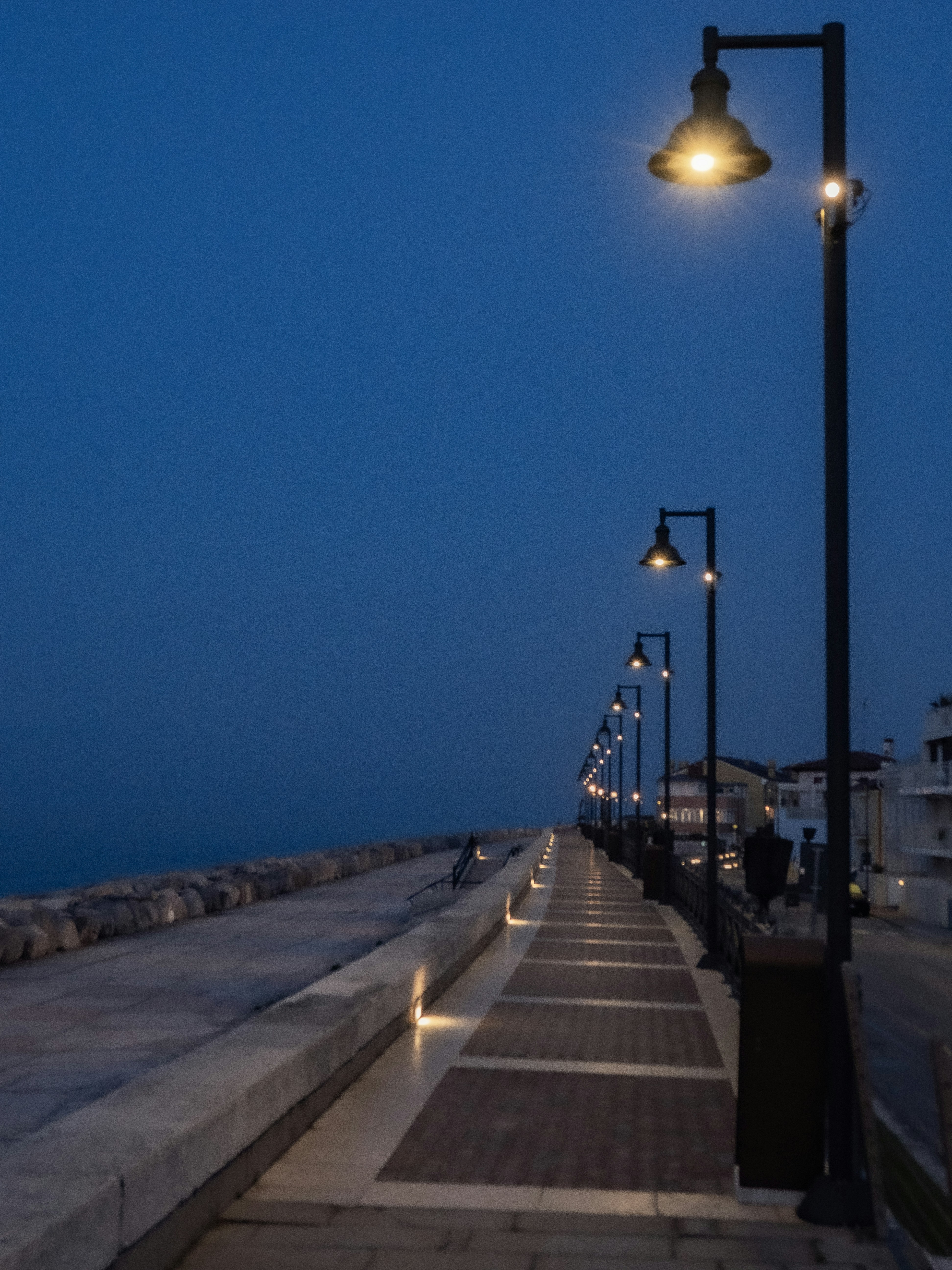 Evening Lantern Row Along a Seaside Promenade