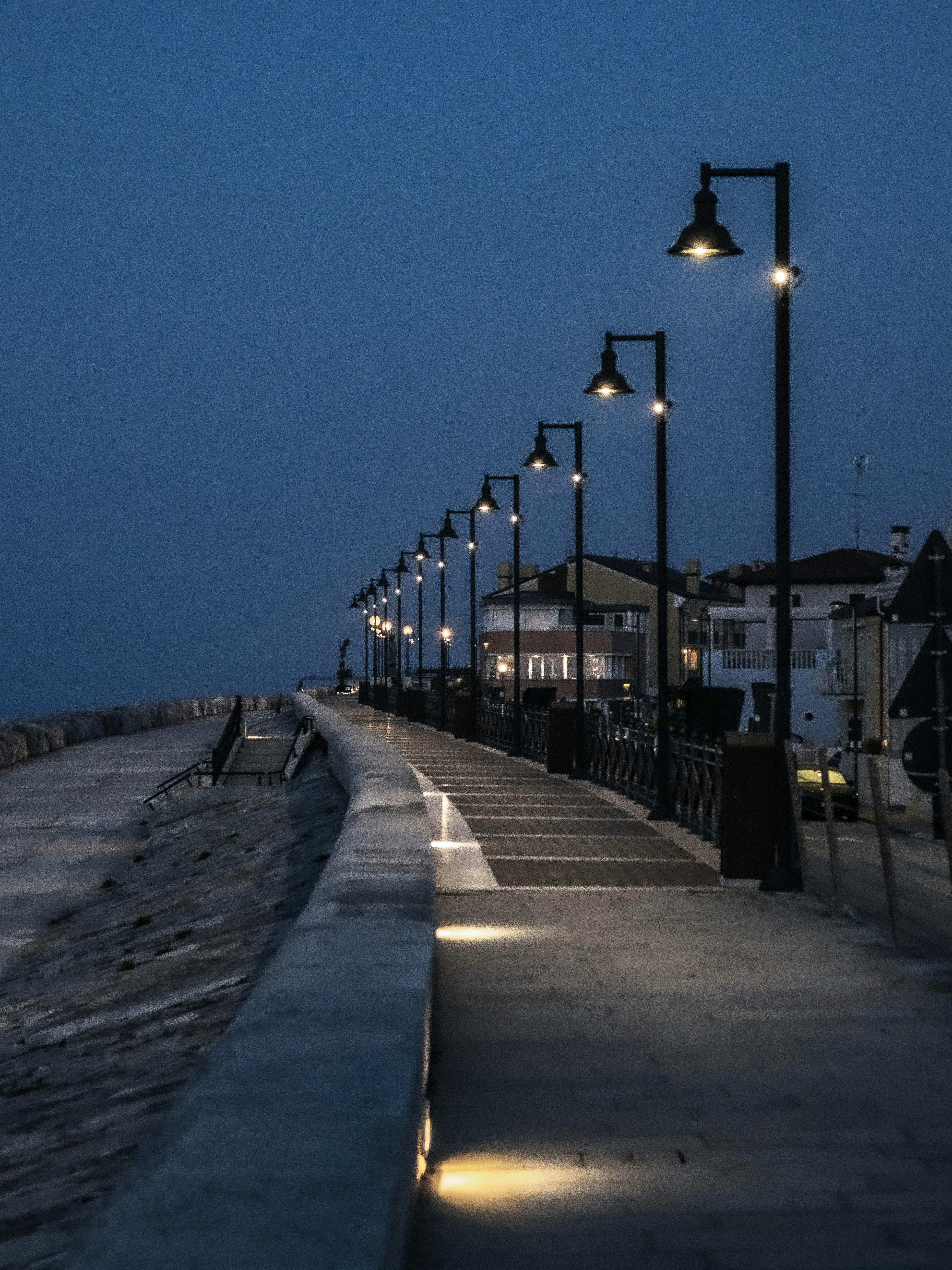 Evening Promenade: Velvet Lights Along the Sea Wall