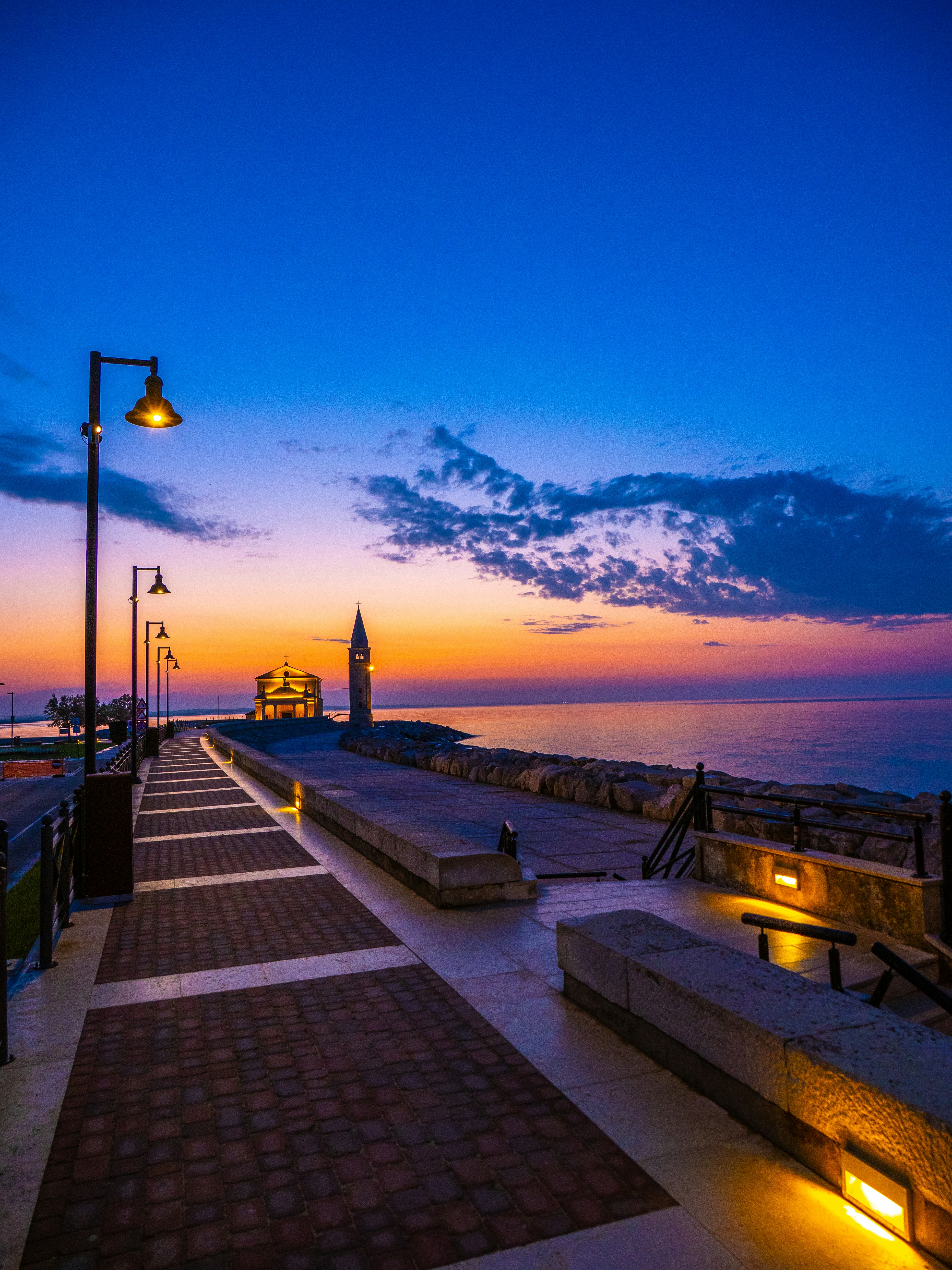 Sunset Pier: Lanterns and Sea Horizon