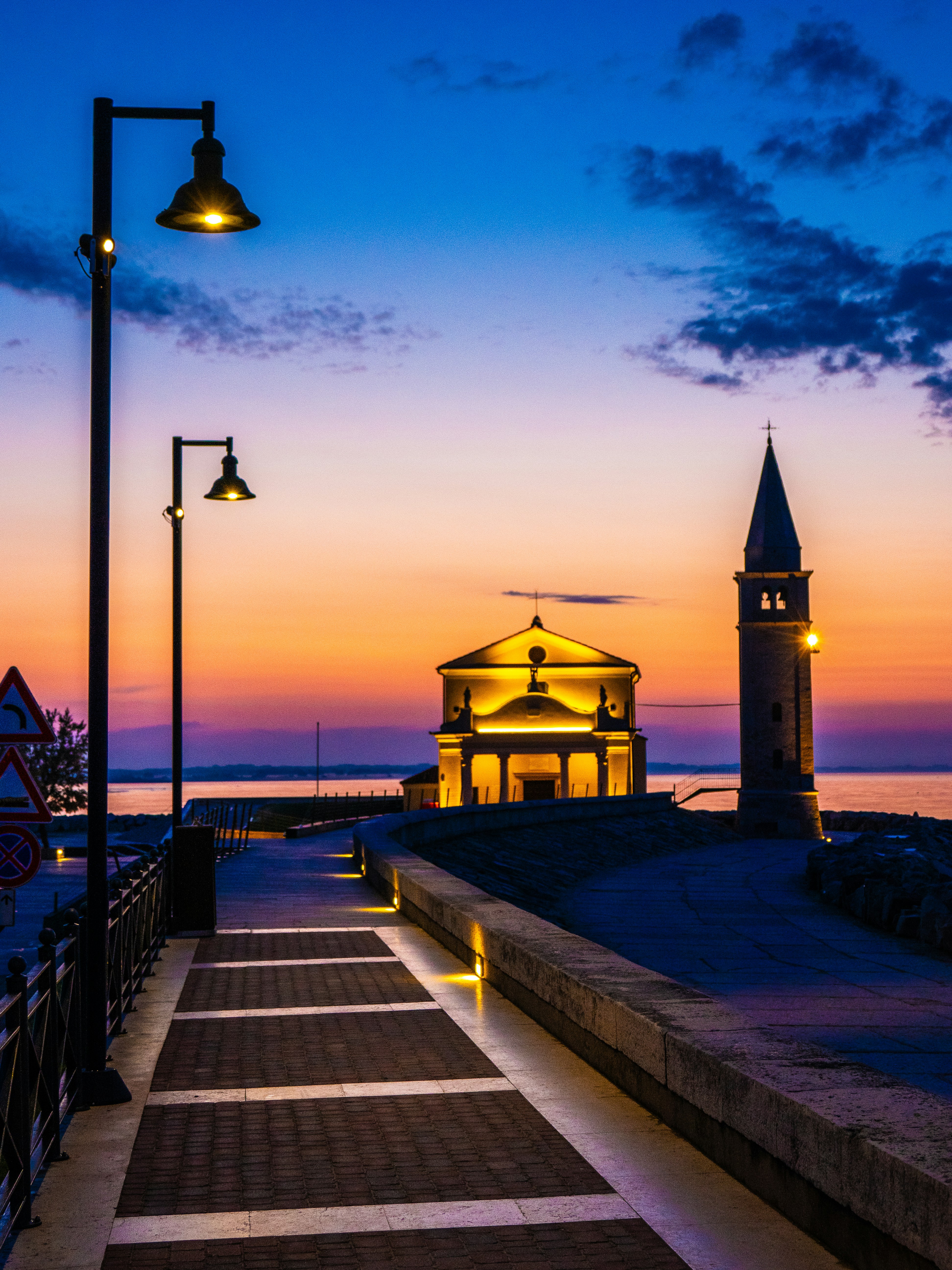 Golden Arch by the Sea: Evening Path to the Lighthouse