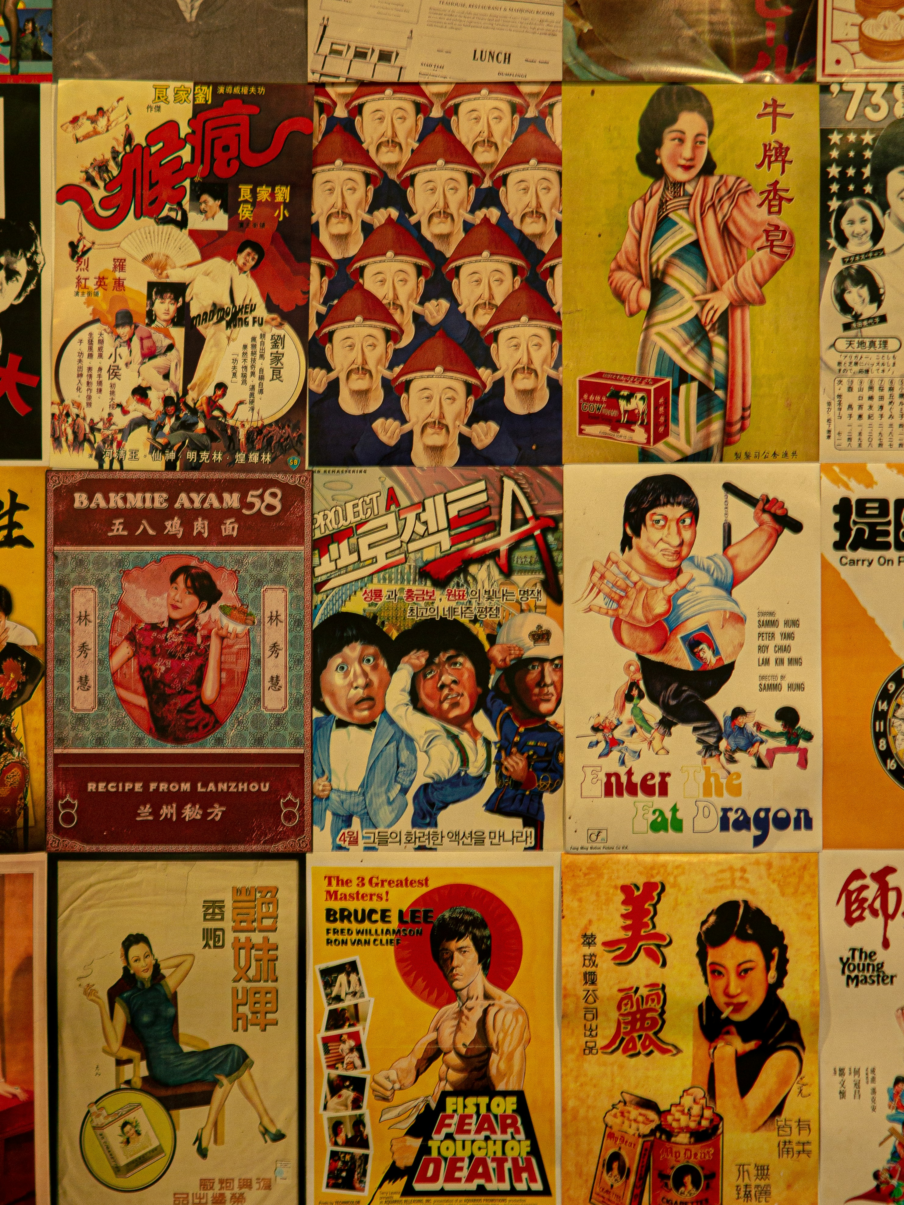 Collage of Vintage Movie Posters: A Wallpaper of Bold Faces and Color