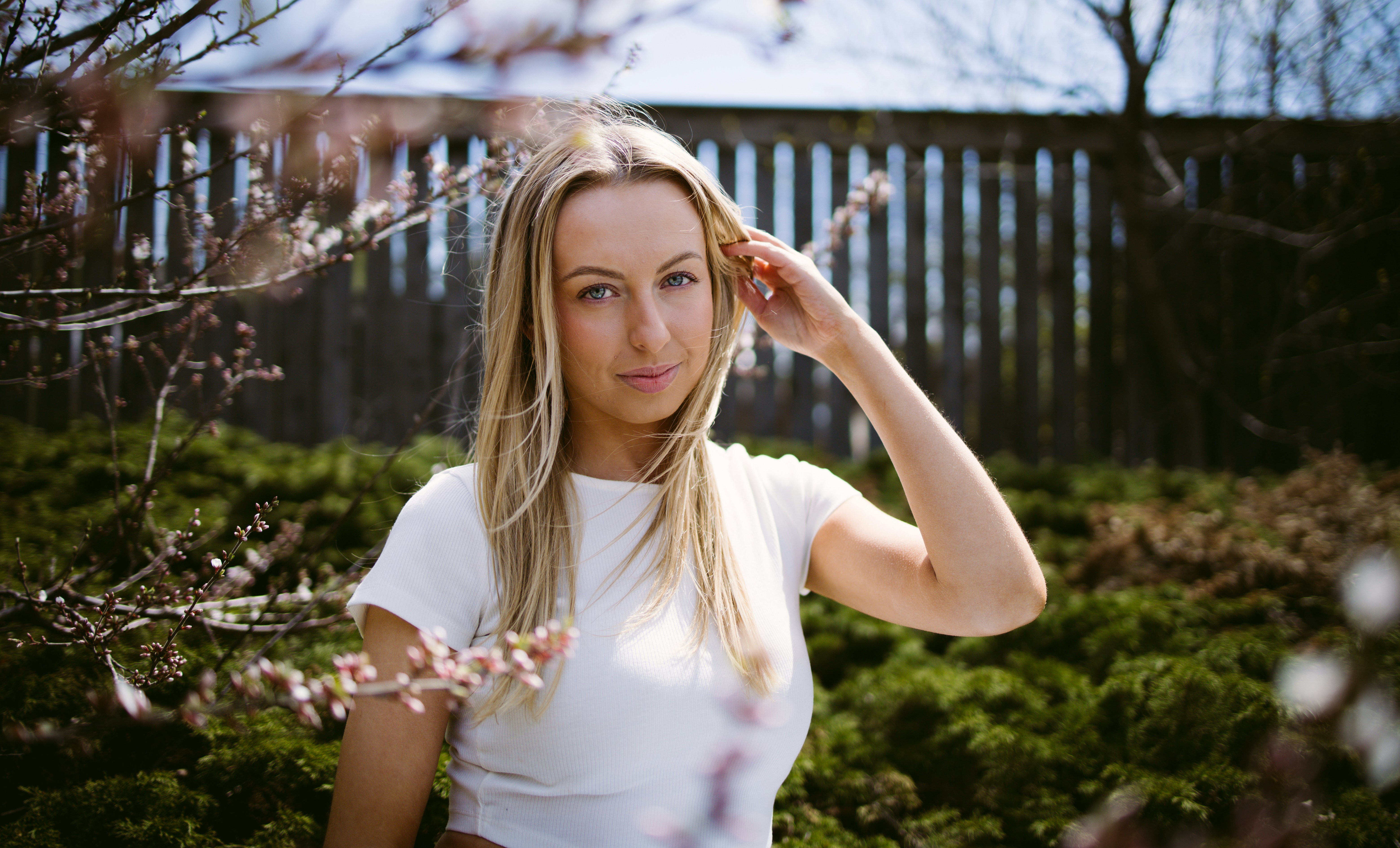 Sunlit Center: Portrait of a Blonde Woman in a Garden