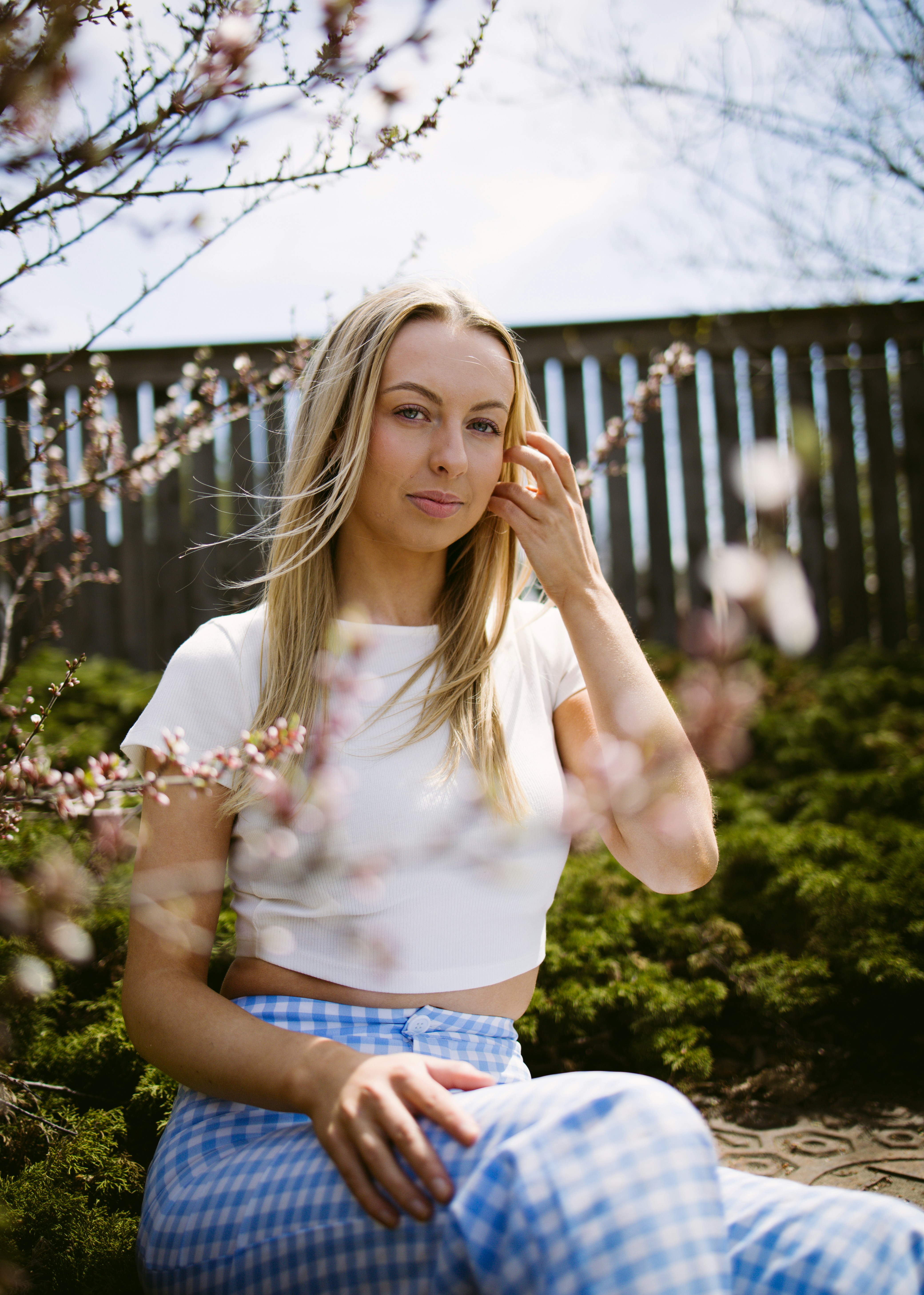 A Quiet Moment in Bloom: Portrait Amid Spring Blossoms