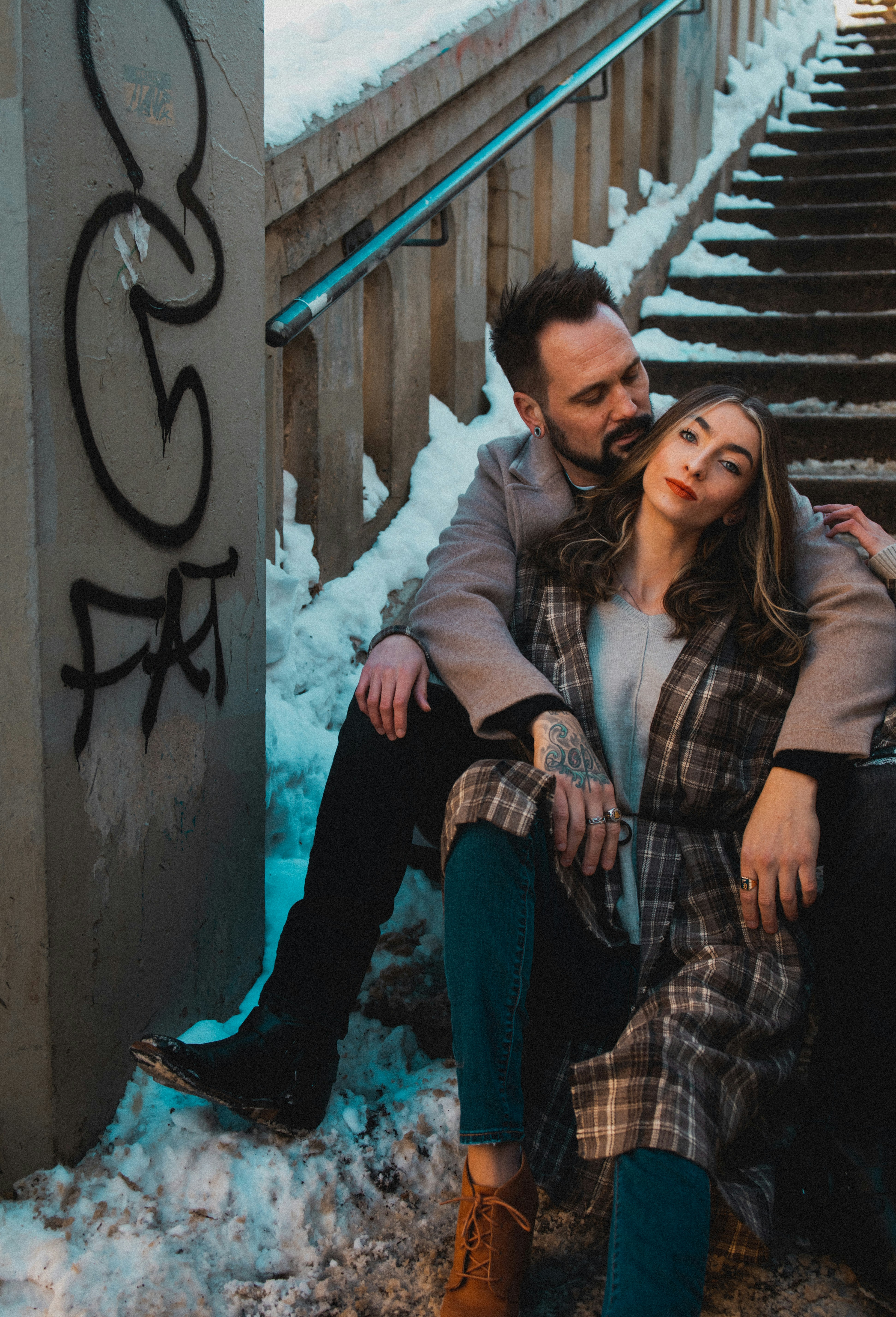 Cozy Embrace on Snow-Cooled Steps