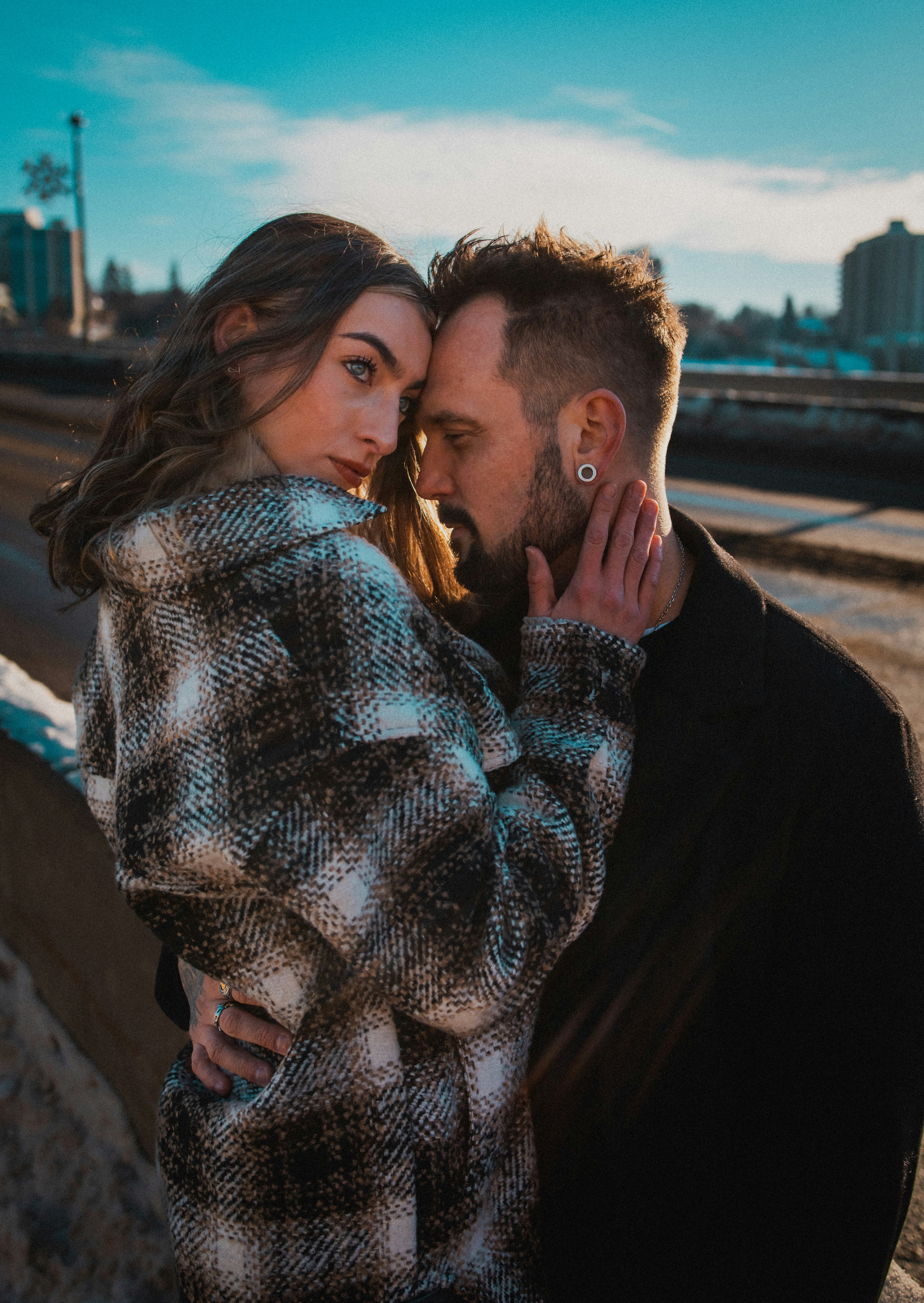 Close Embrace on a Wind-Washed Rooftop