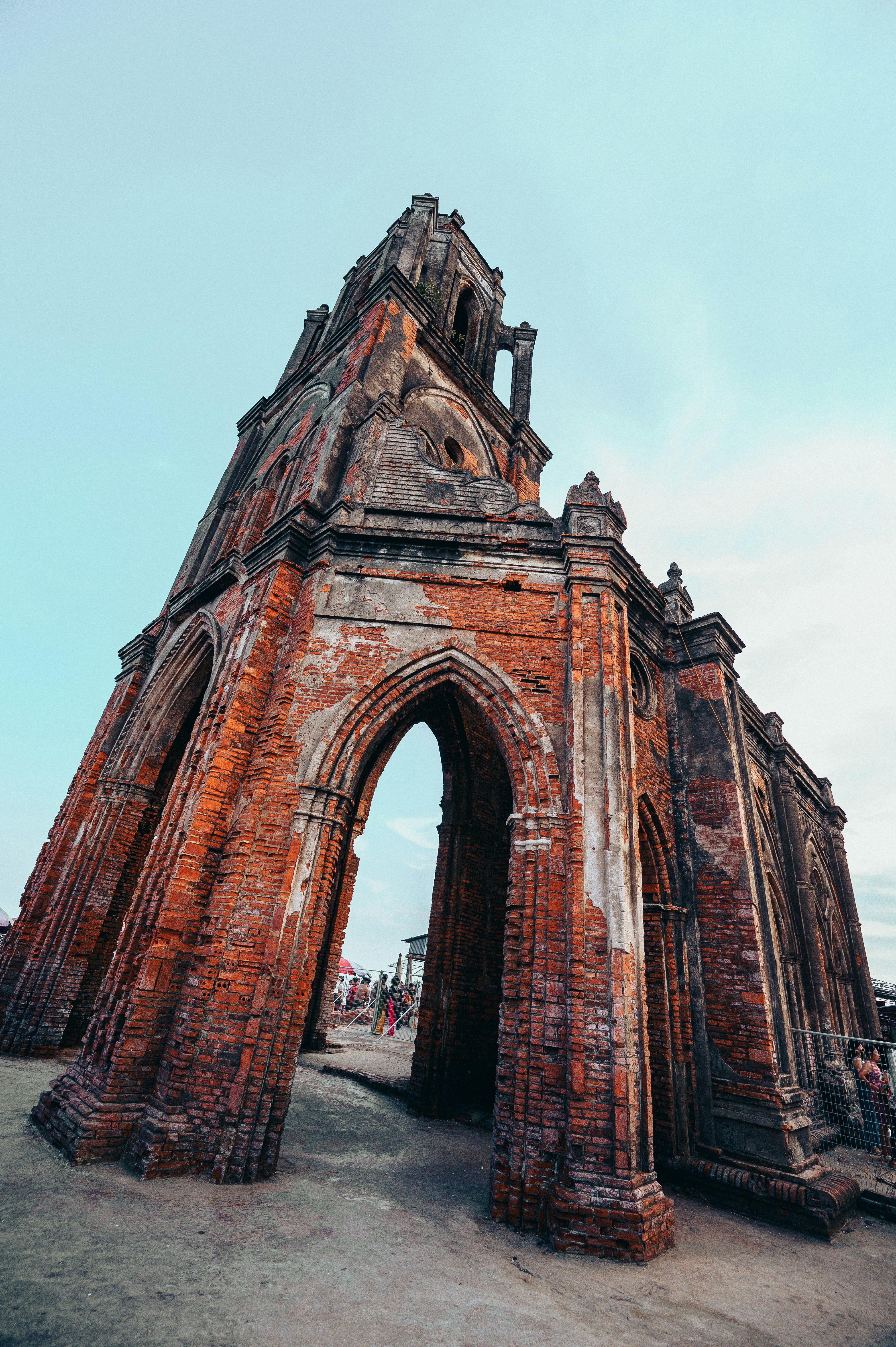 Ruined Archway Rising Above A Sunny Sky