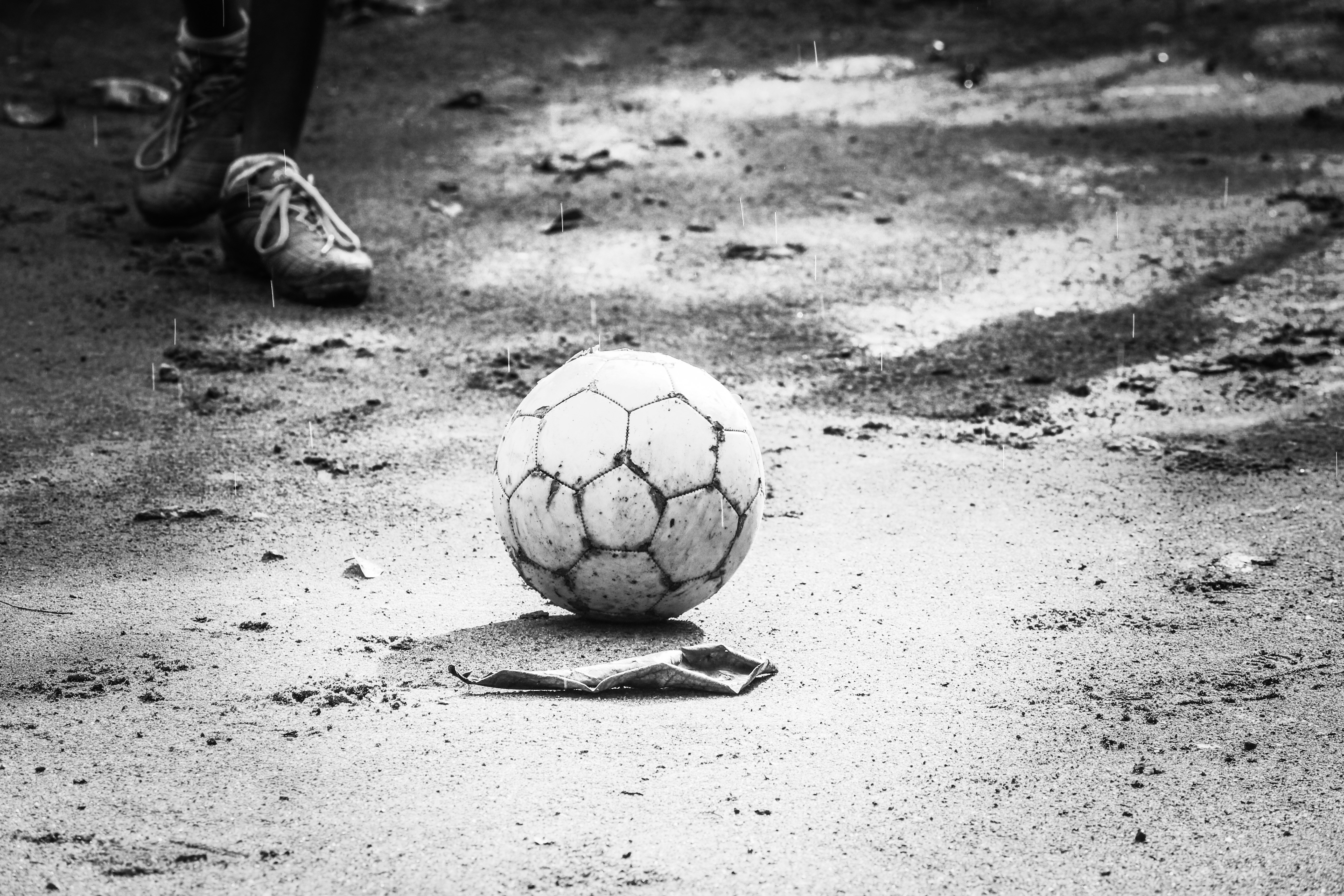 The Quiet Kickoff: A Lone Ball on a Weathered Field