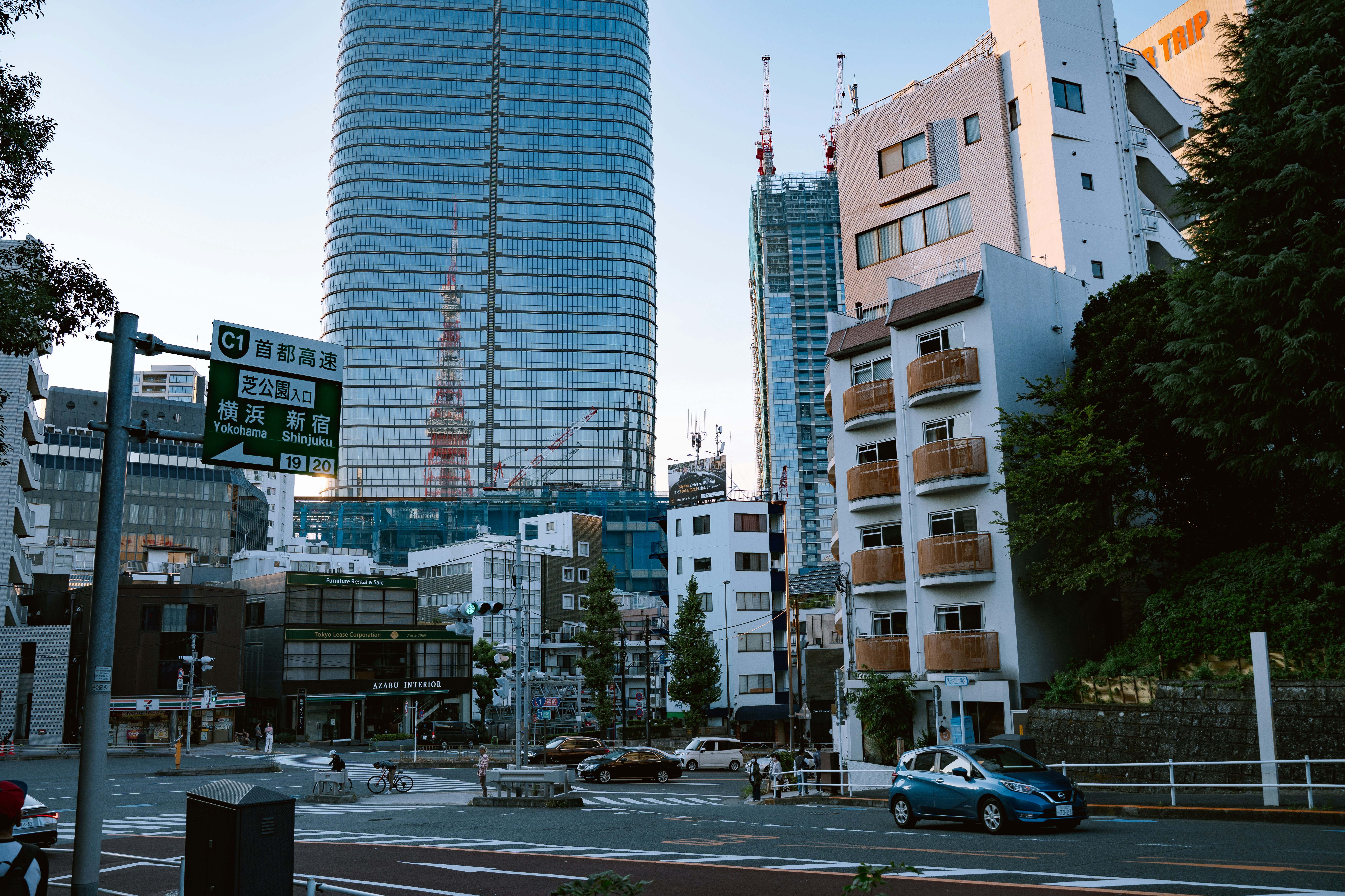 City Silhouette at Dusk: Glass Tower Overlooked by Mid-Rise Echoes
