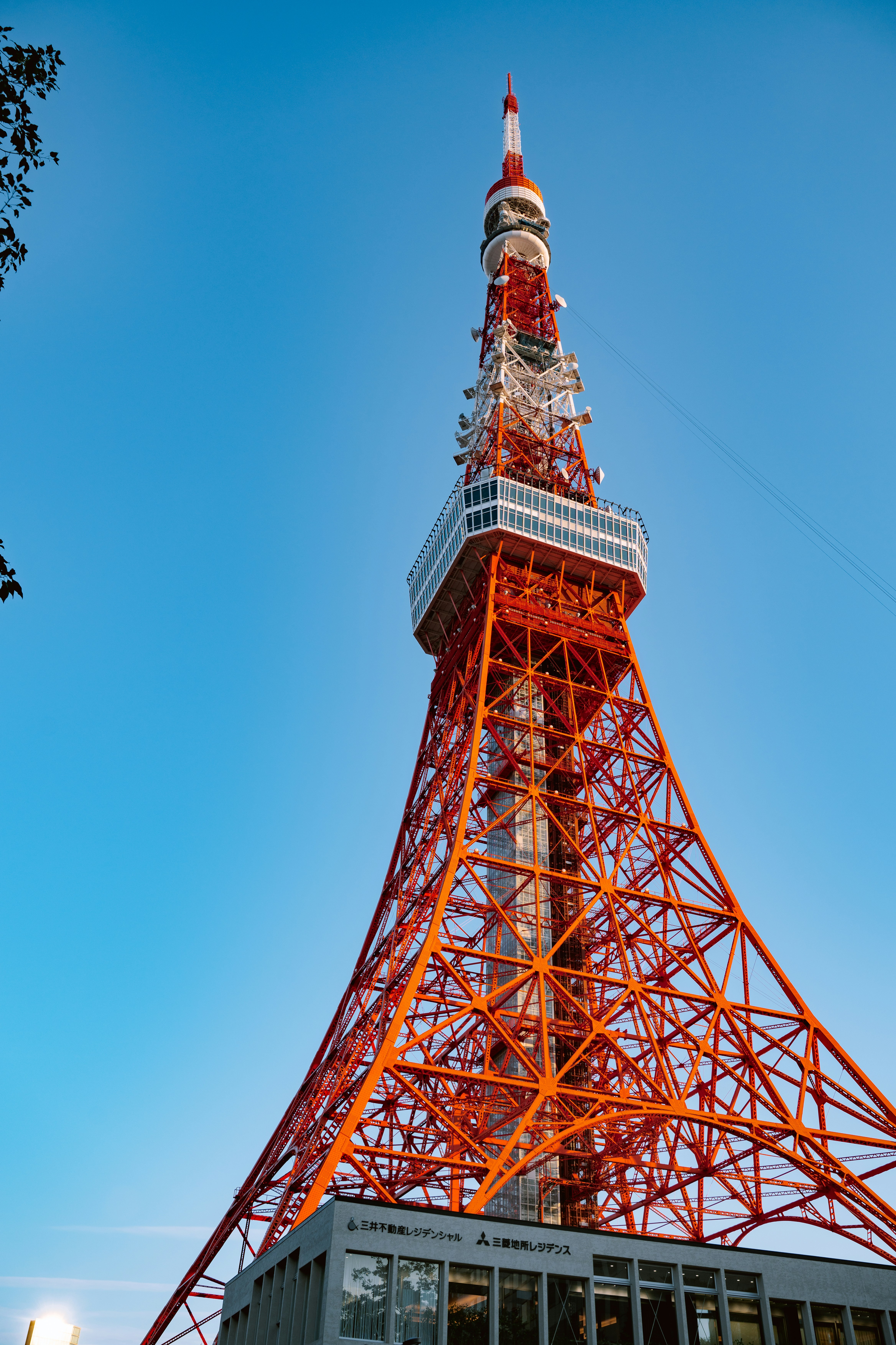 Tokyo Tower Piercing the Blue: An Iron Lattice Soaring Above the City