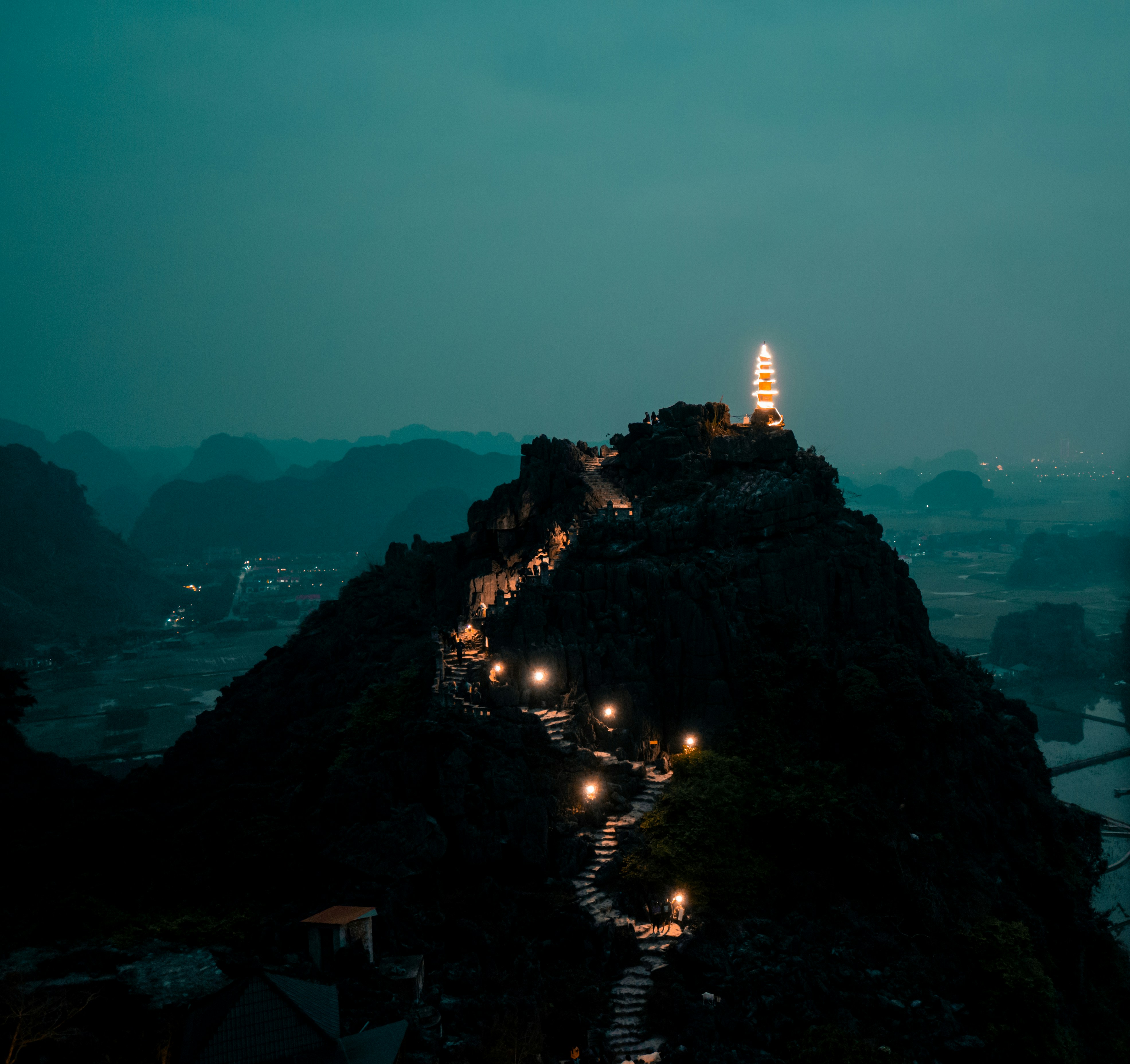 Looming Citadel Crest: A Lantern-Lit Path to the Summit