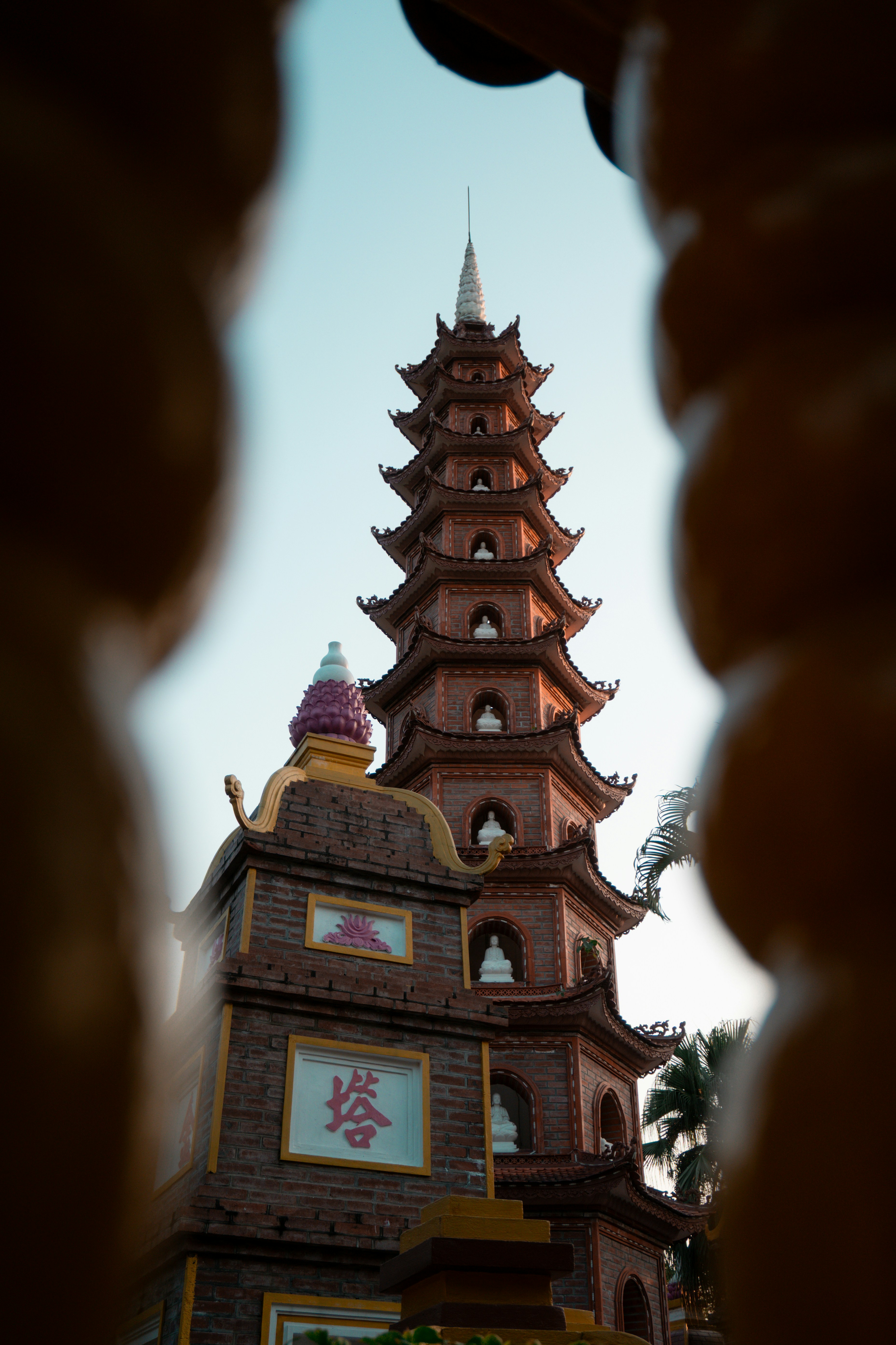 Tall brick pagoda with multiple tiers against sky