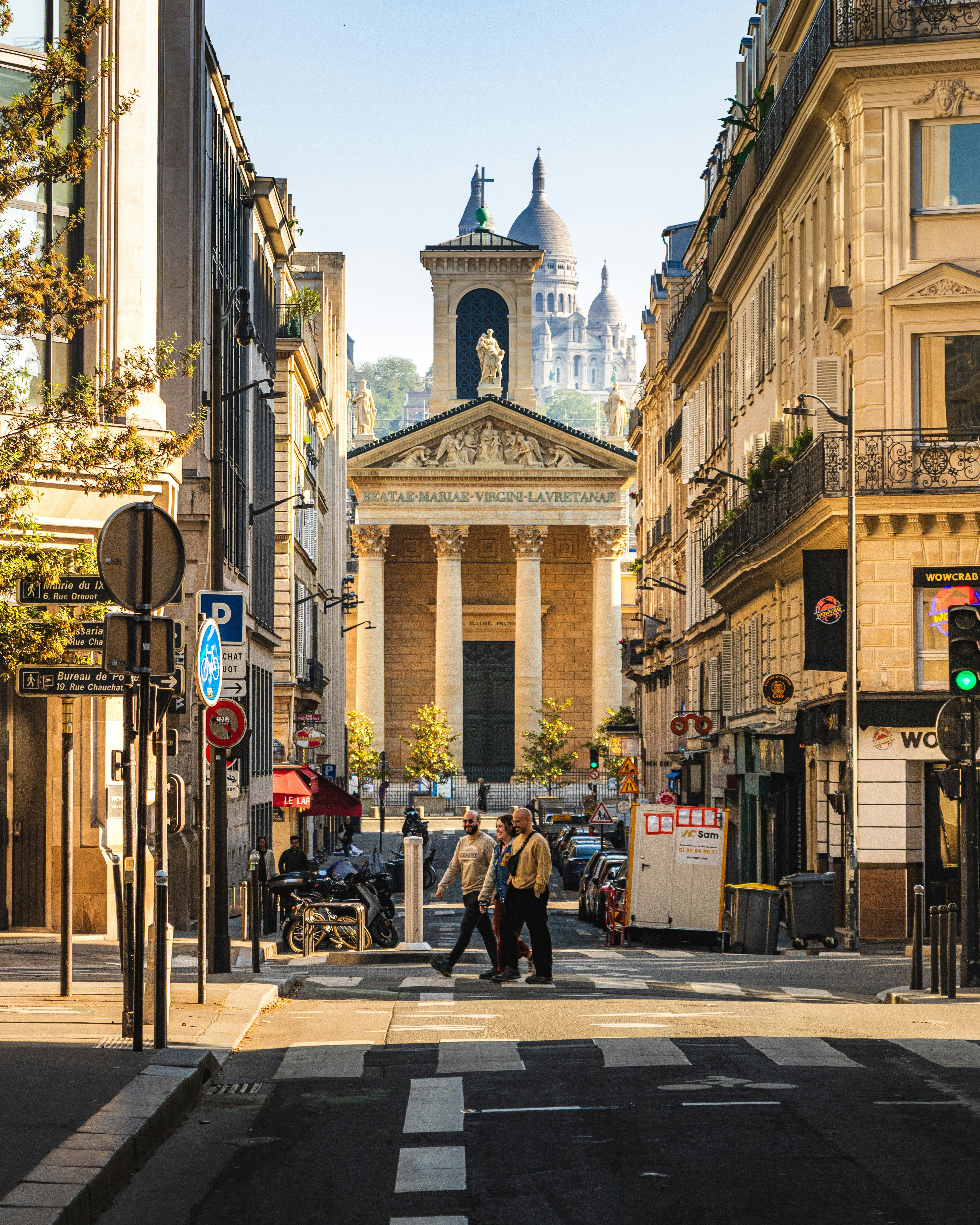 Stately Neoclassical Facade Framed by Parisian Street Life