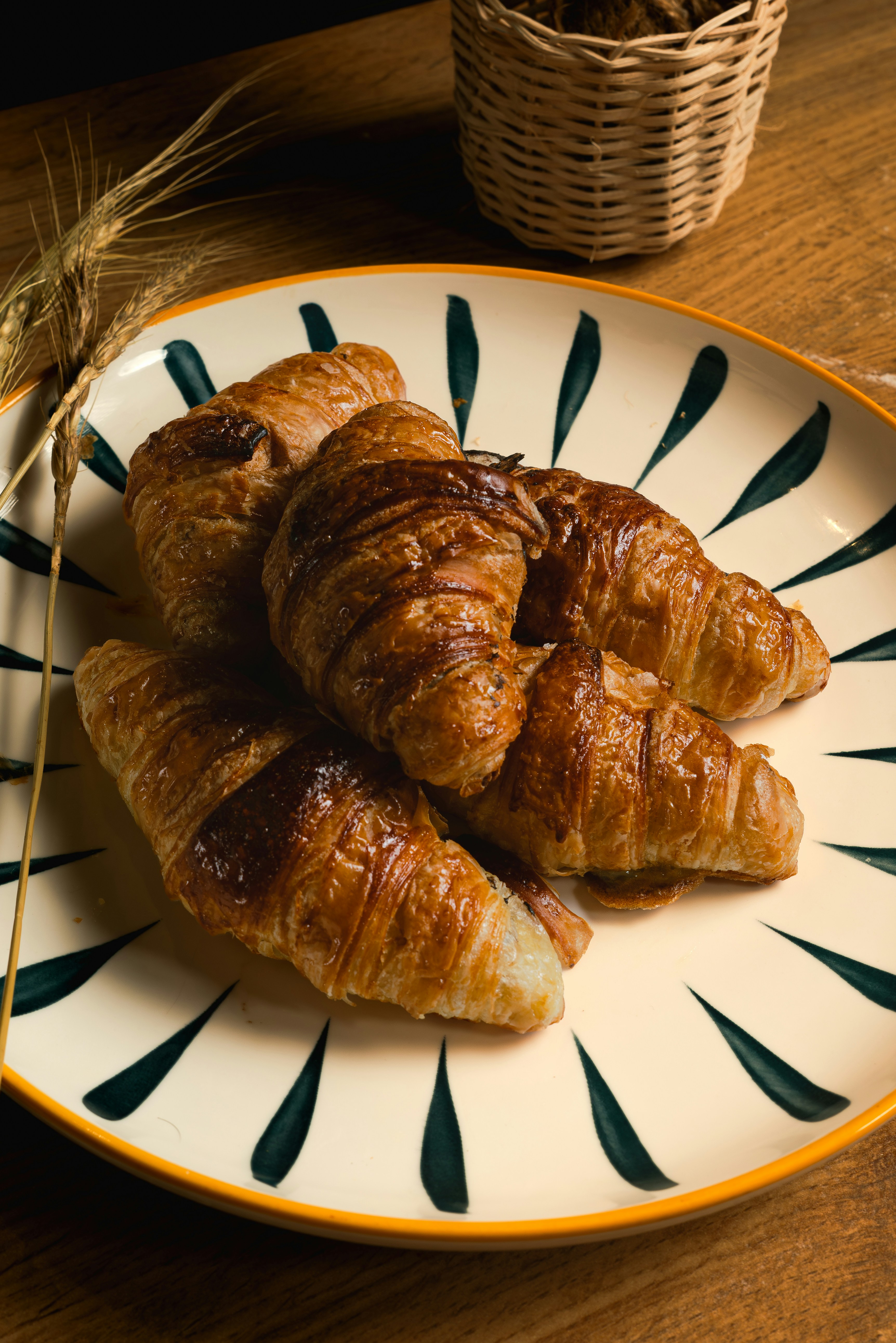 Golden Crescent: Croissants on a Decorative Plate