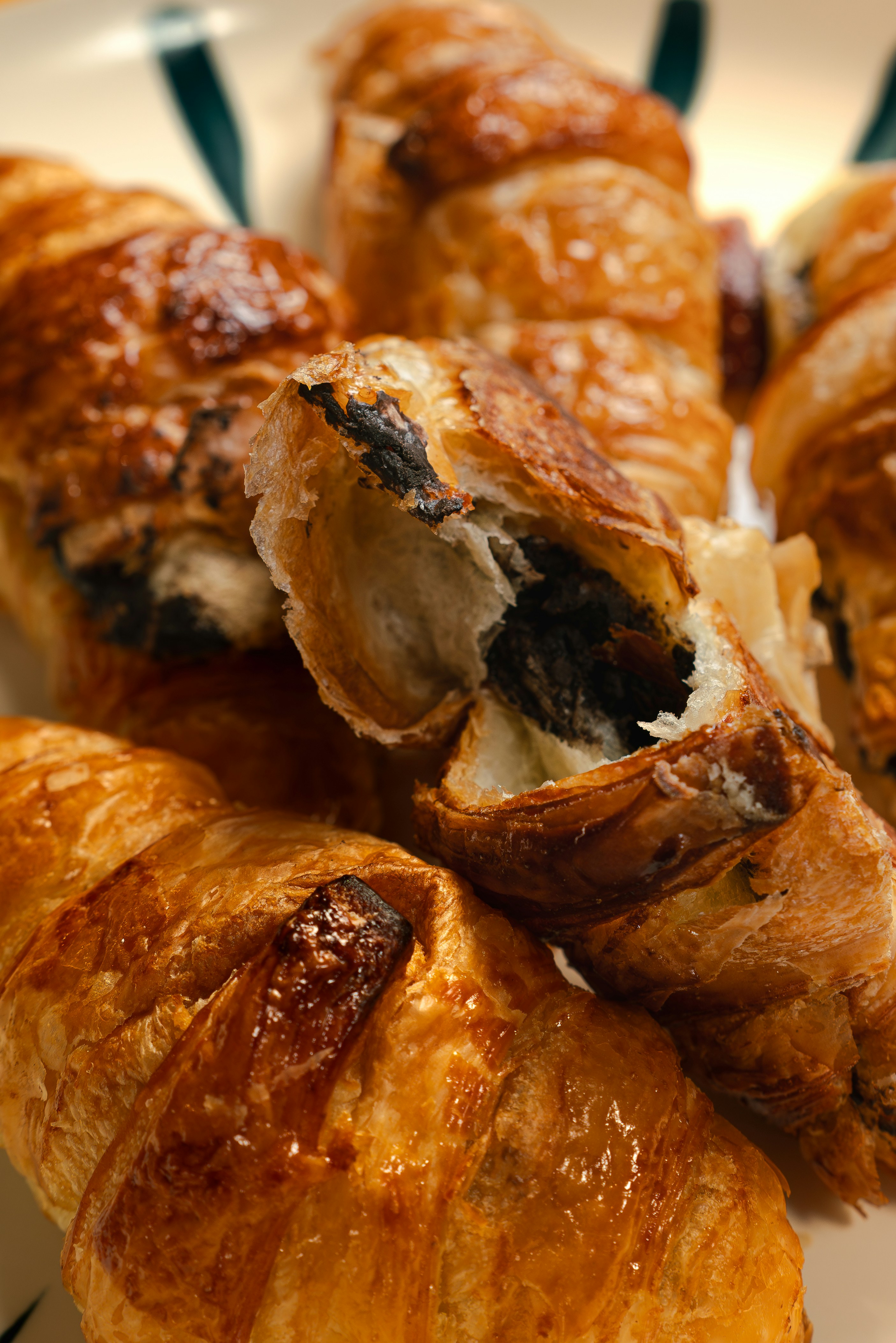 Crusty croissant mosaic: flaky bites and a torn center